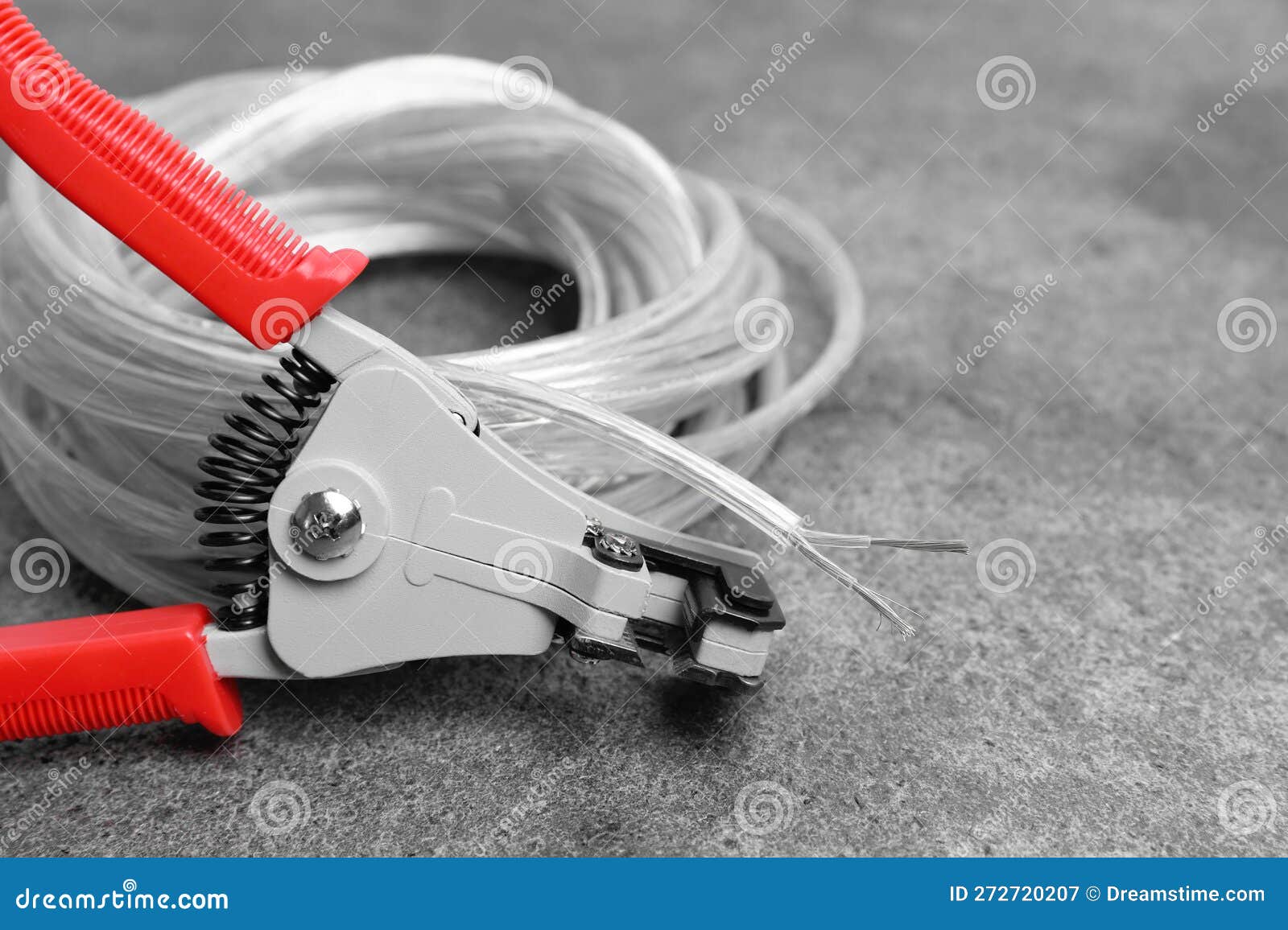 Cutters and Cable with Stripped Wire on Light Gray Textured Table ...