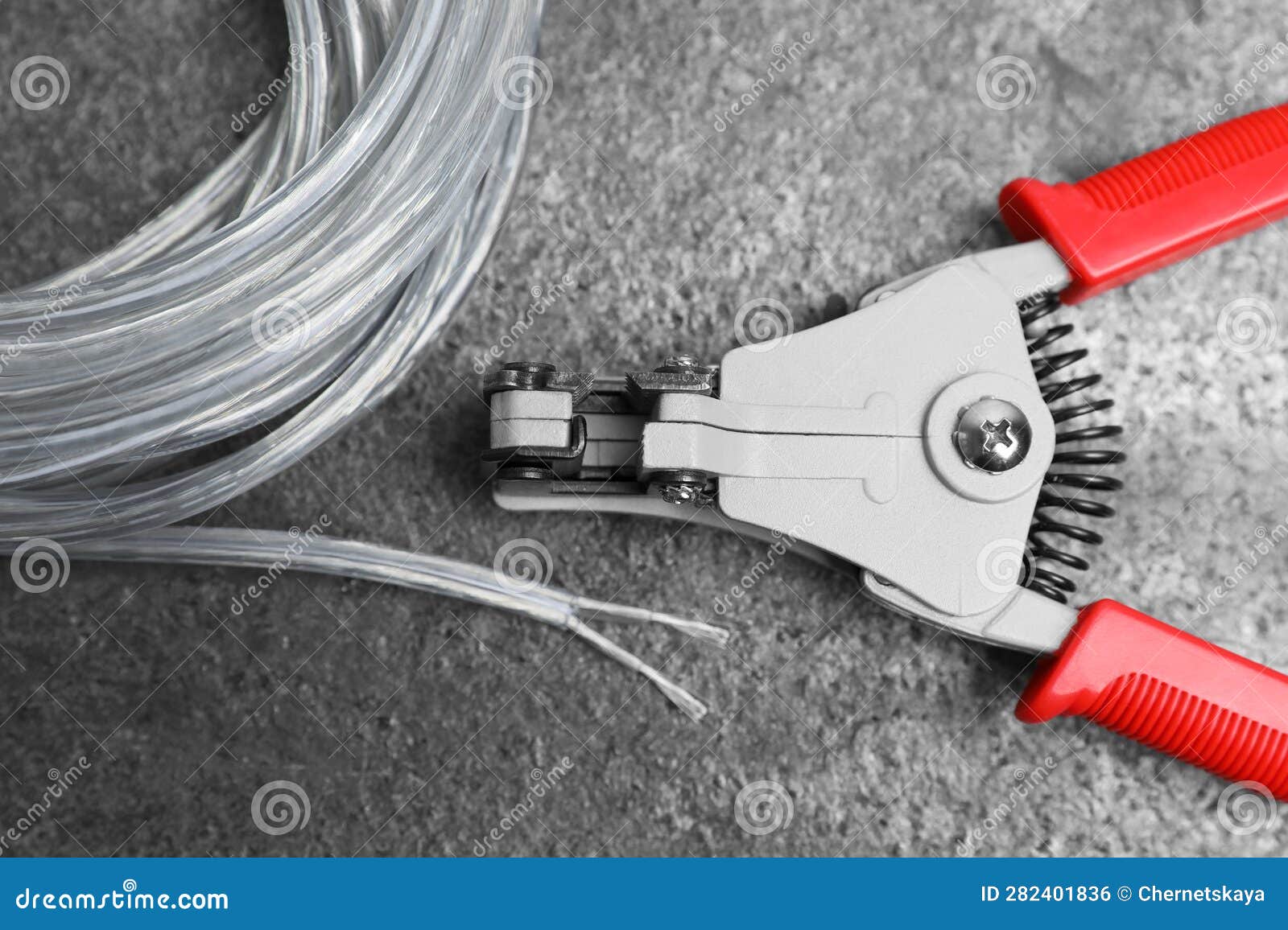 Cutters and Cable with Stripped Wire on Light Gray Textured Table, Flat ...