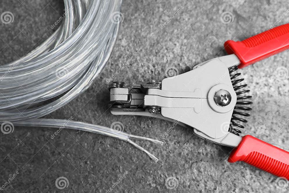 Cutters and Cable with Stripped Wire on Light Gray Textured Table, Flat ...