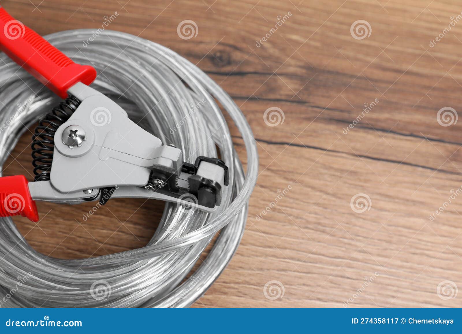 Cutters and Cable with Stripped Wire on Wooden Table, Closeup. Space ...