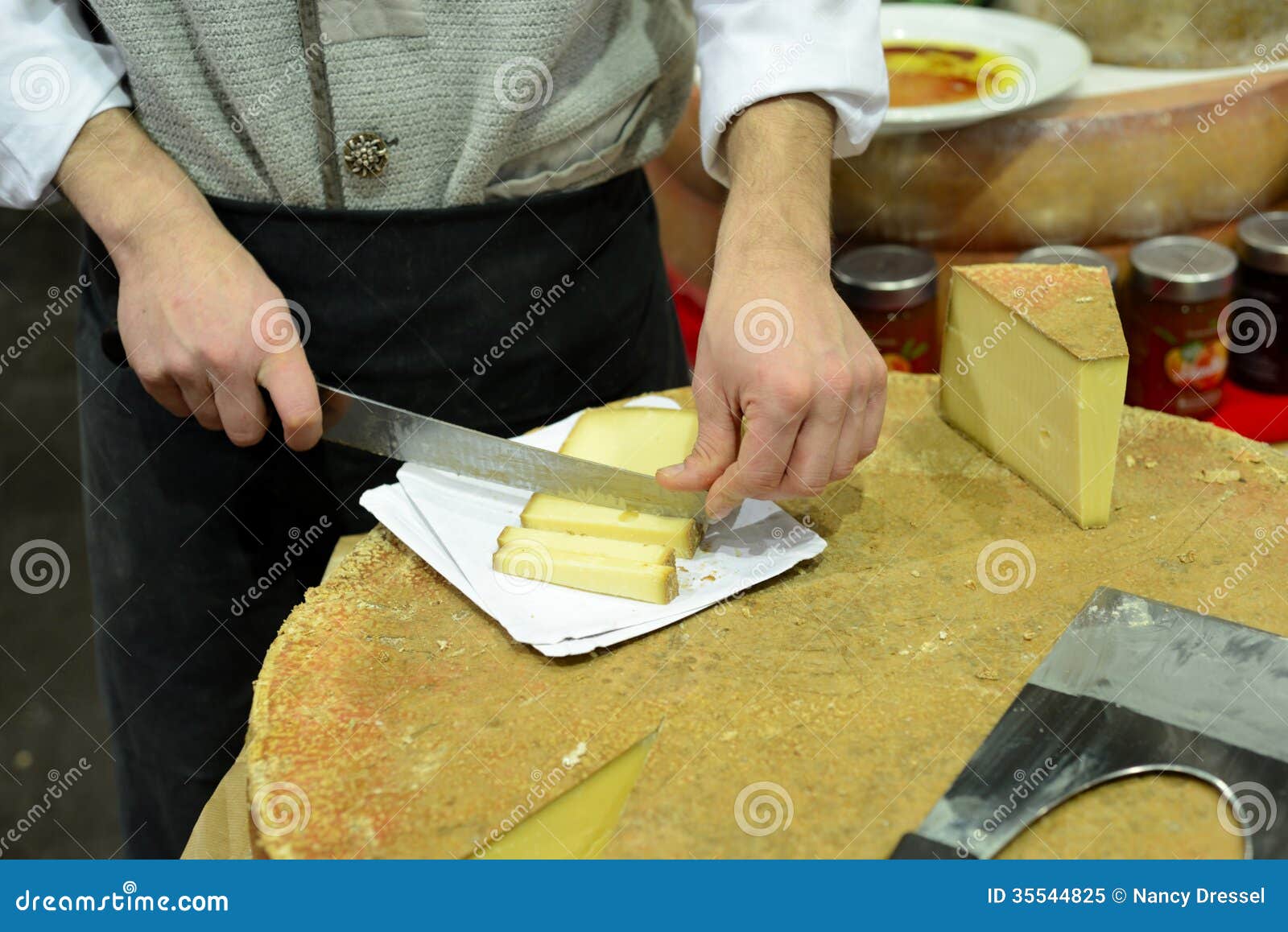 Cutting a Big Piece of Cheese Stock Image - Image of gastronomy, dairy ...