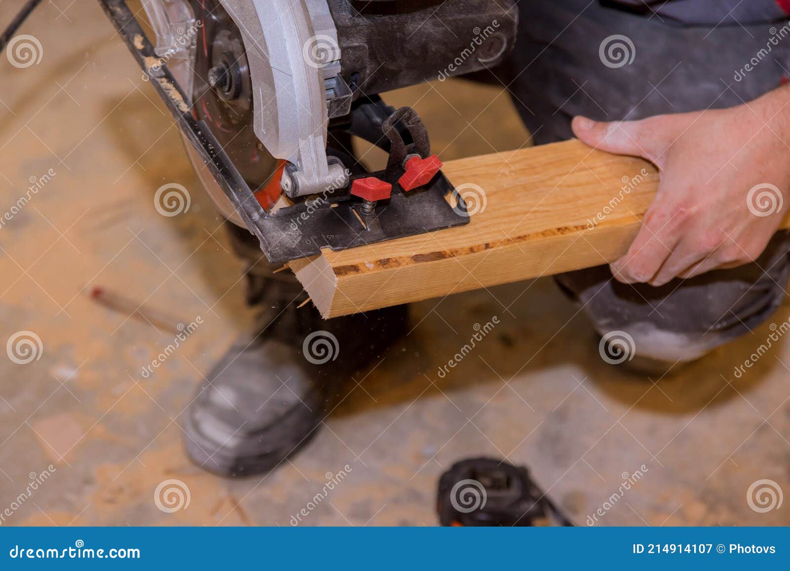 Cutting Beam Using an Electrical Chain Saw Professional Tools Stock ...