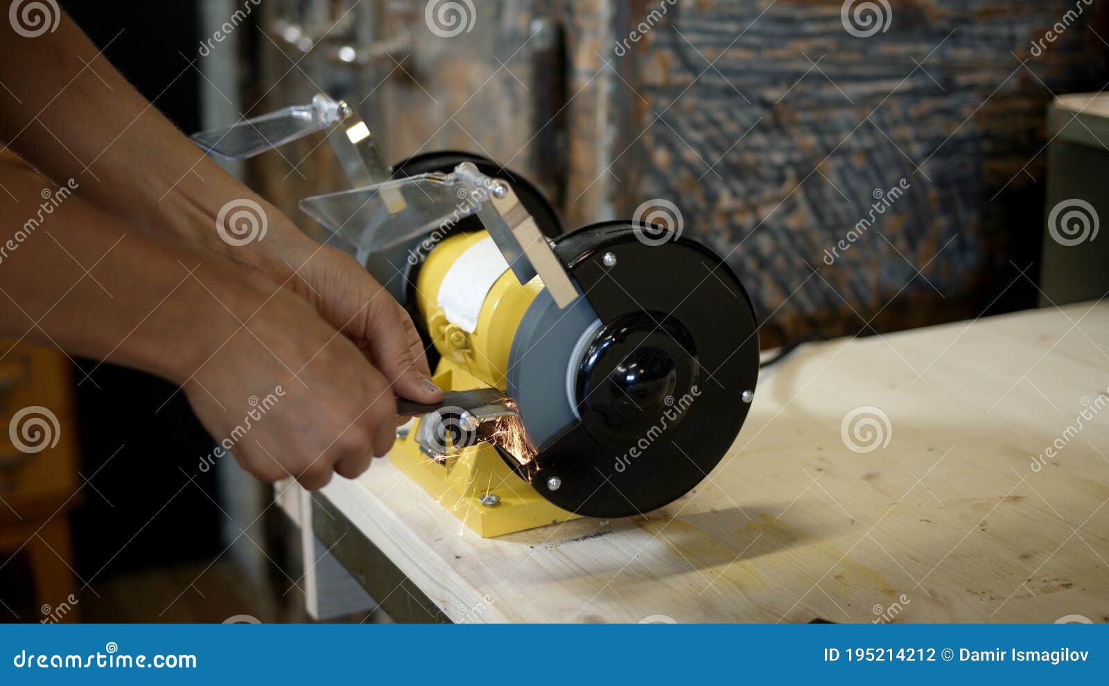 Electric Sharpener and Blade Close Up, Hands Cutting Knife Stock Photo ...