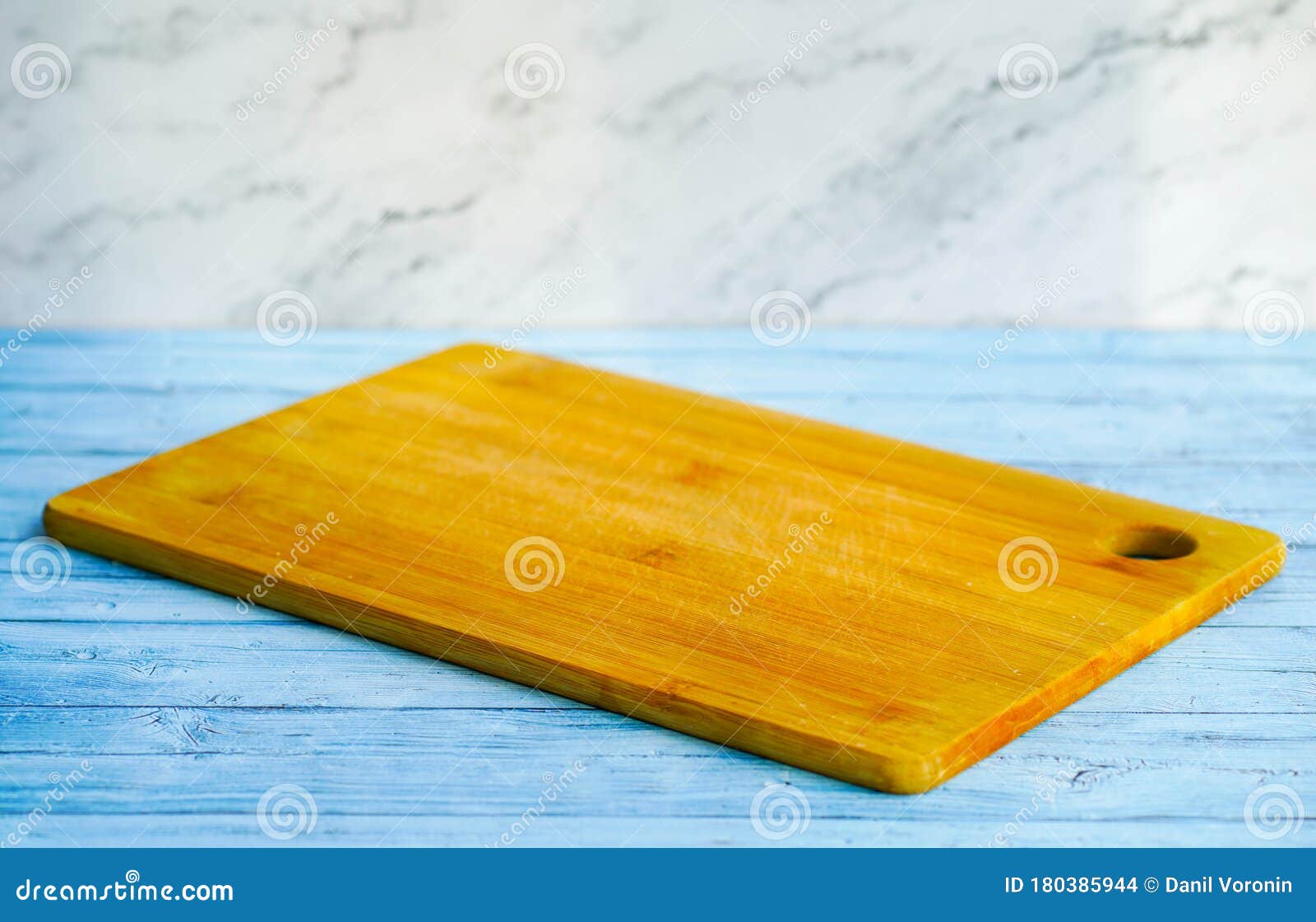 Wooden Cutting Board on a Blue Background Stock Photo - Image of rustic ...