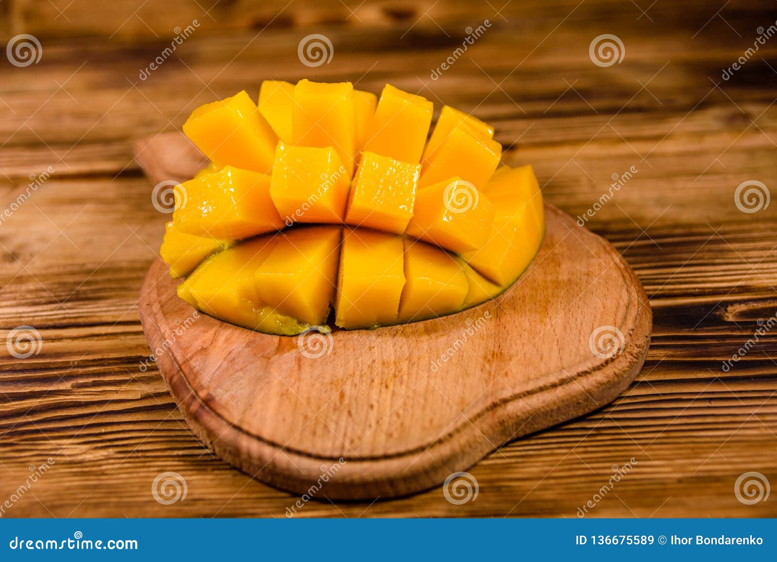 Cutting Board with Chopped Mango Fruit on a Wooden Table Stock Image ...