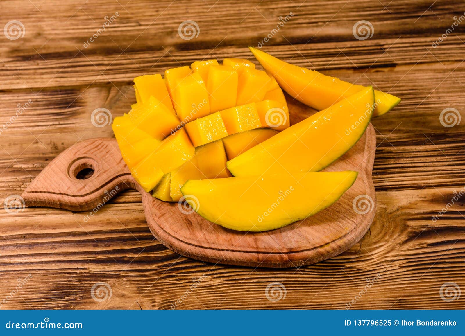 Cutting Board with Chopped Mango Fruit on a Wooden Table Stock Image ...