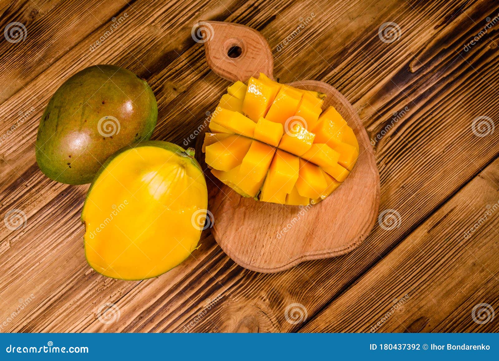 Cutting Board with Chopped Mango Fruit on a Wooden Table. Top View ...