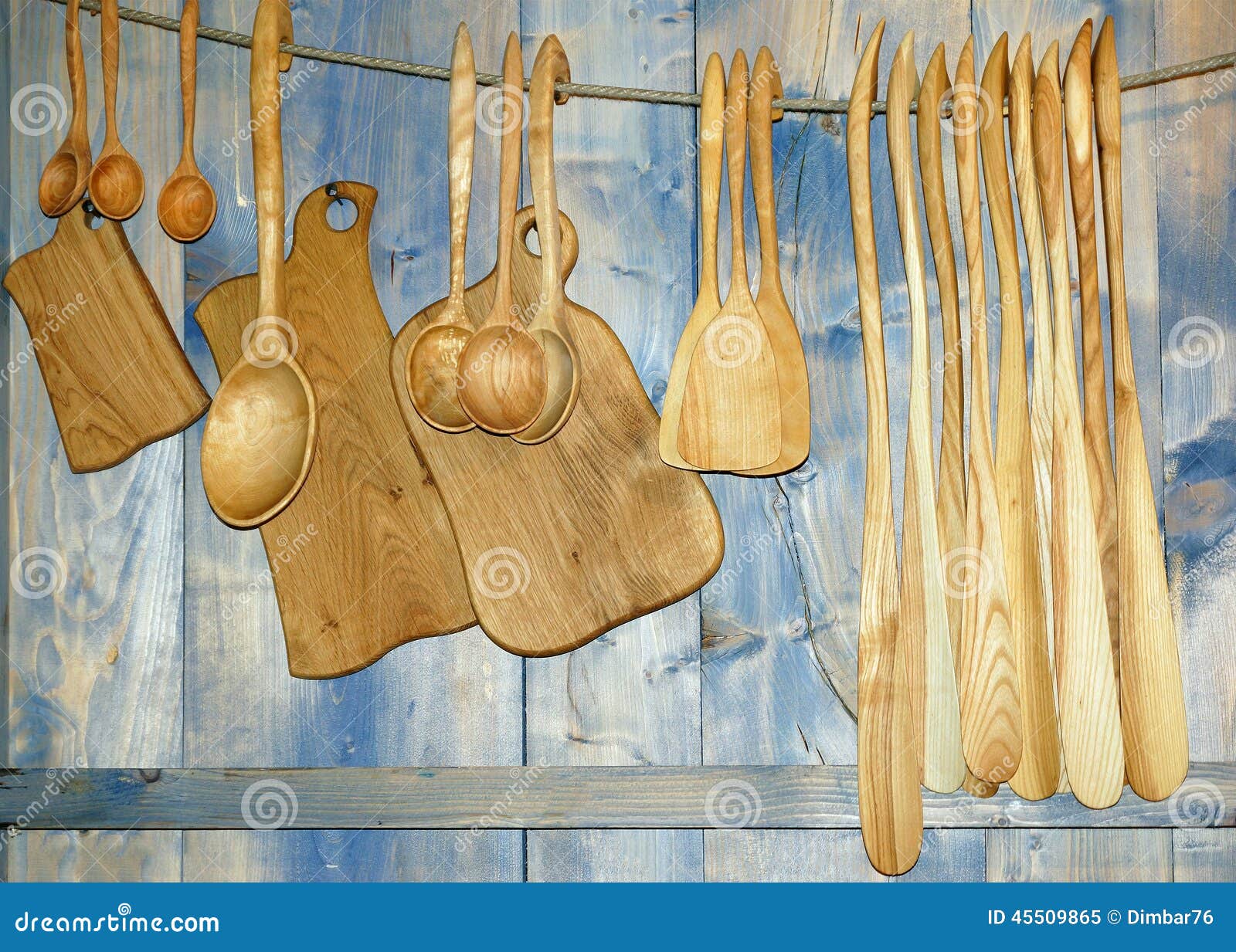 Cutting Boards and Wooden Spoons Hanging on the Wall, Tableware Stock ...