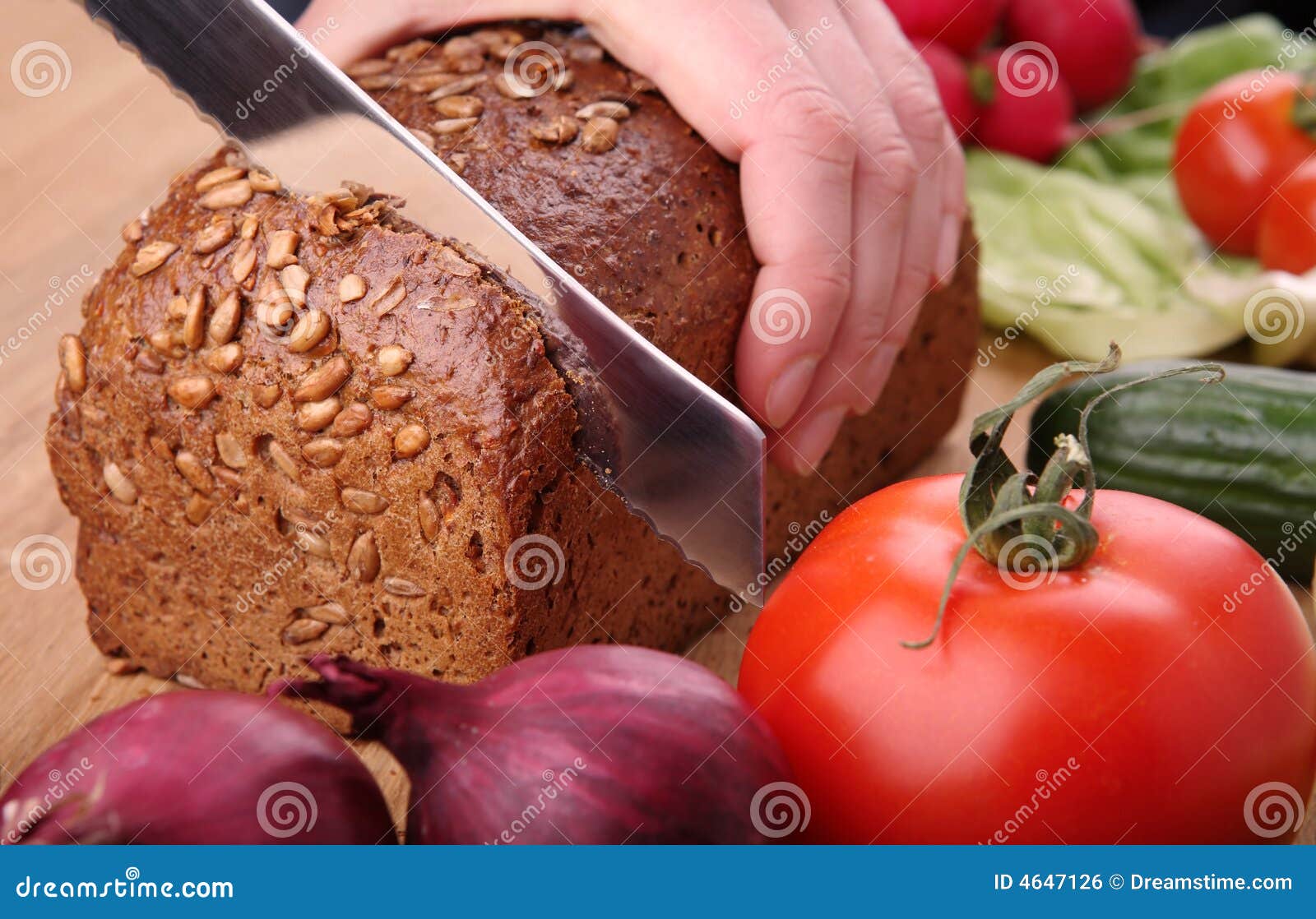Cutting the bread stock photo. Image of tomato, radish - 4647126