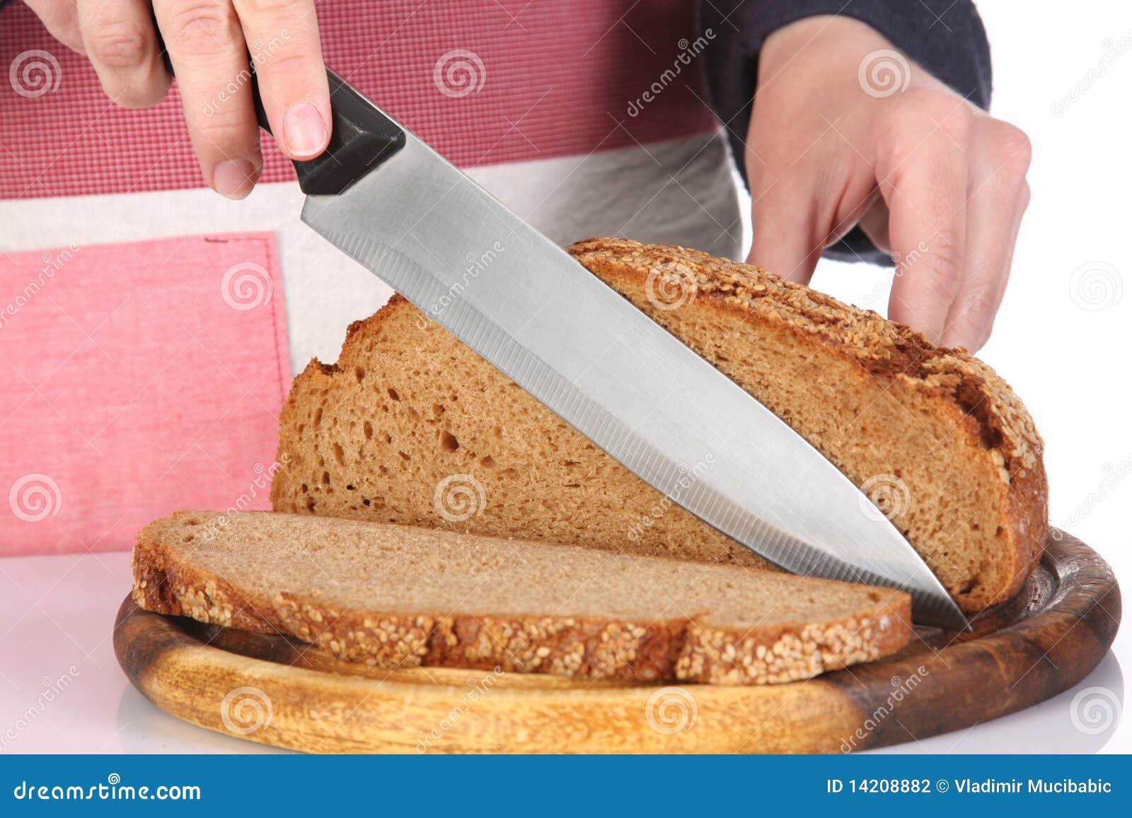Cutting bread with knife stock photo. Image of golden - 14208882