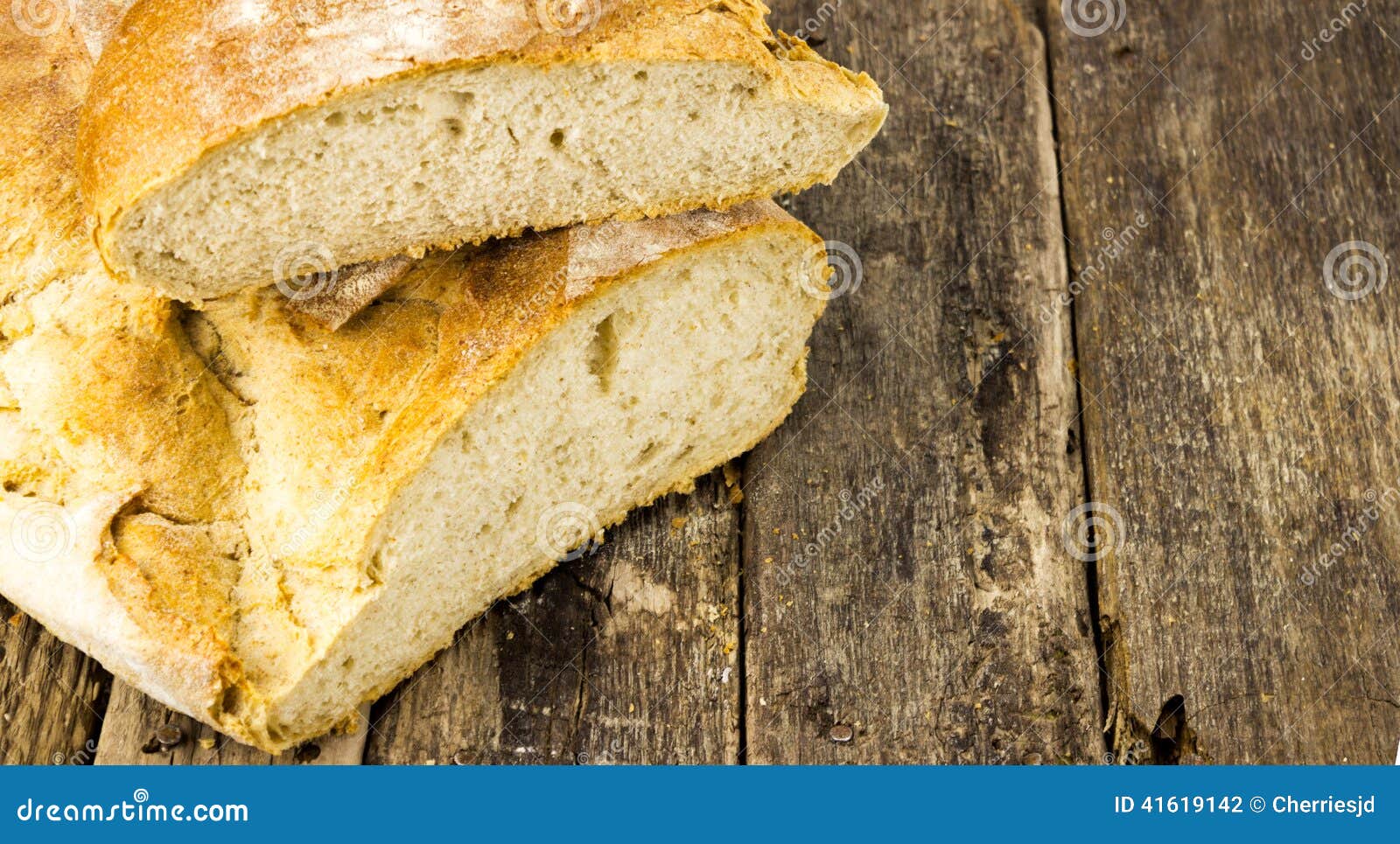 Cutting Bread on Wooden Table Stock Photo - Image of bread, freshness ...