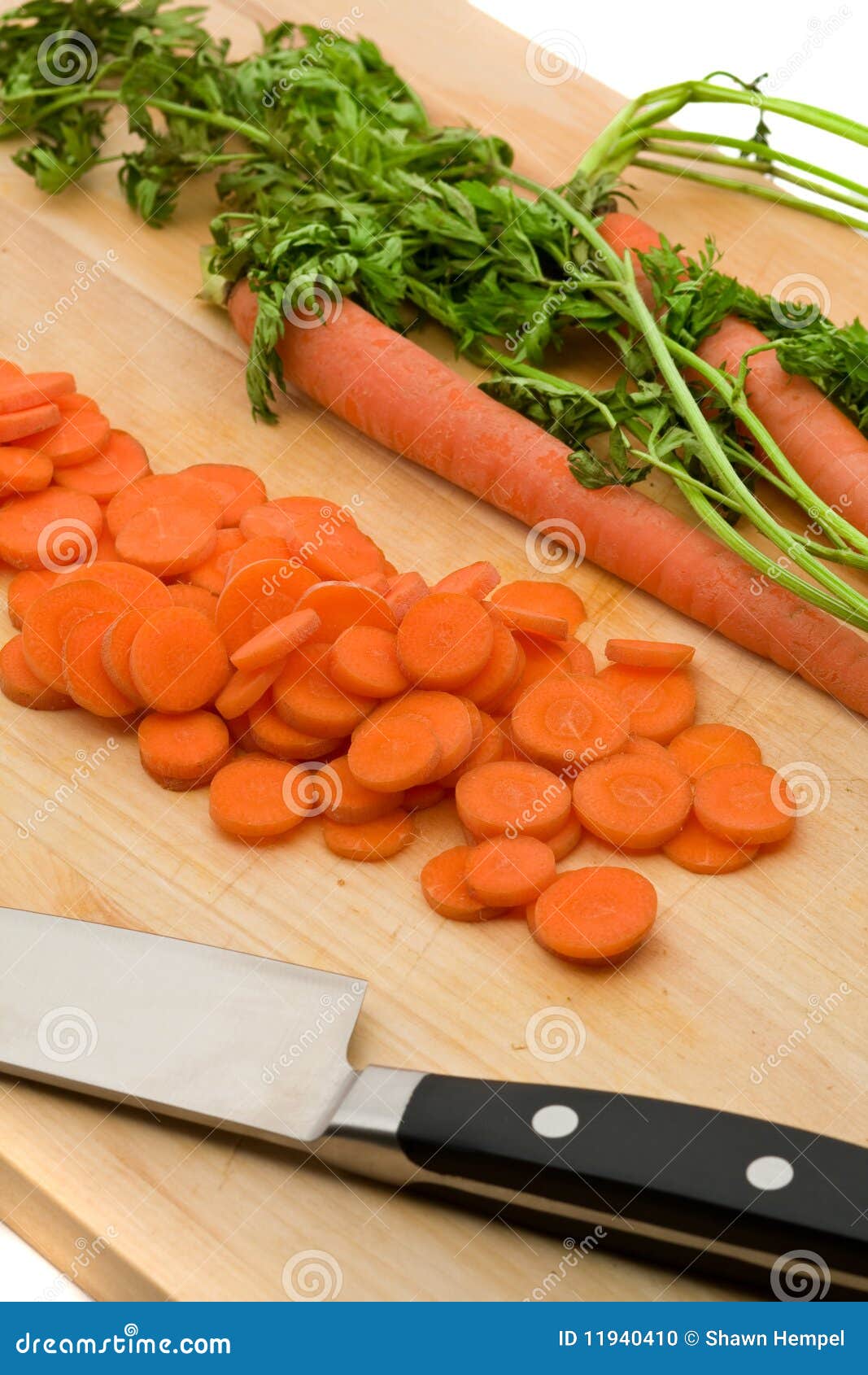 Cutting carrots stock photo. Image of bunch, root, close - 11940410
