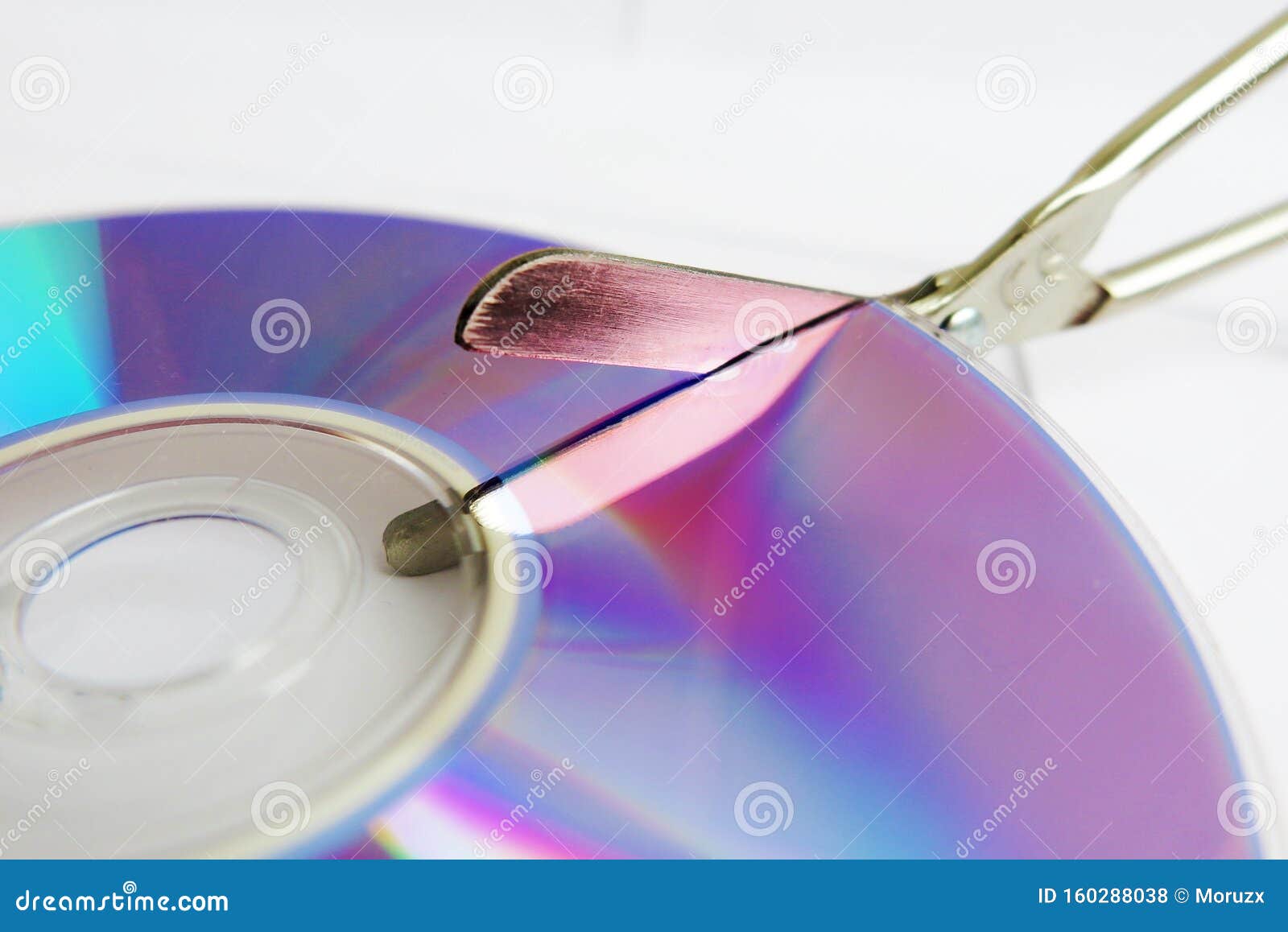 Cutting a CD DVD Disc for Irrecoverably Data Destruction Stock Photo ...