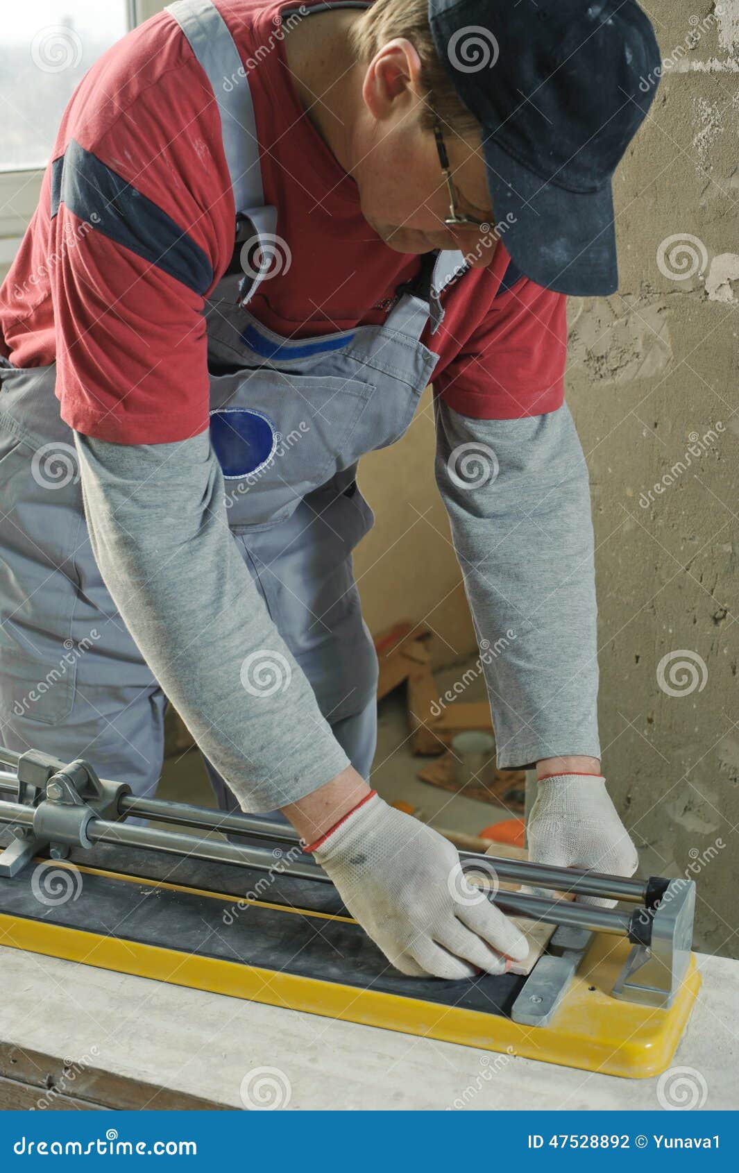 Cutting Ceramic Tiles. Stock Photo | CartoonDealer.com #47528892
