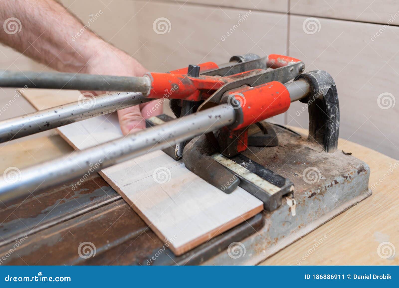 Cutting Ceramic Tiles with a Special Hand Machine with a Sharp Diamond ...