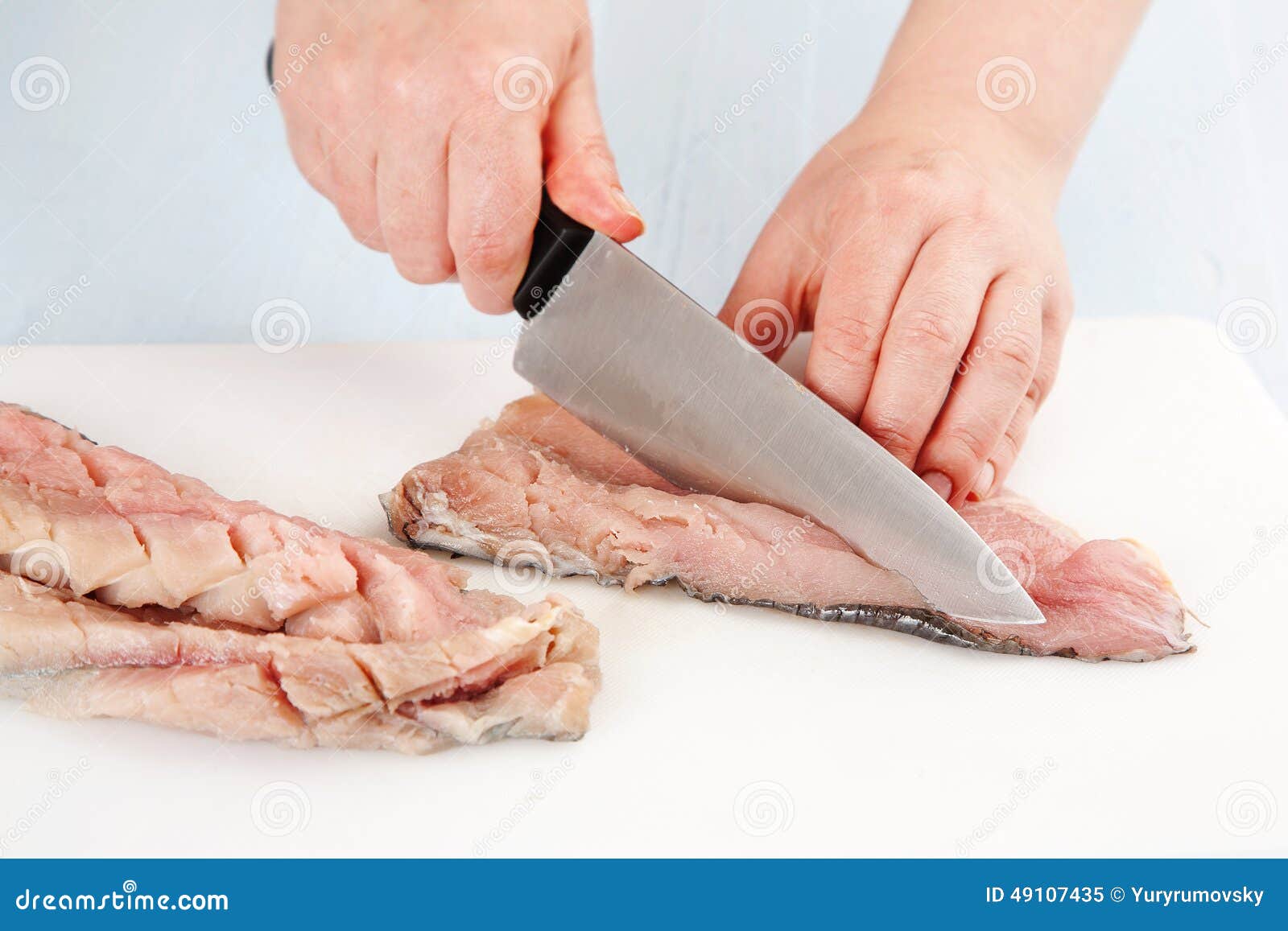 Cutting cod fillets stock image. Image of closeup, food - 49107435