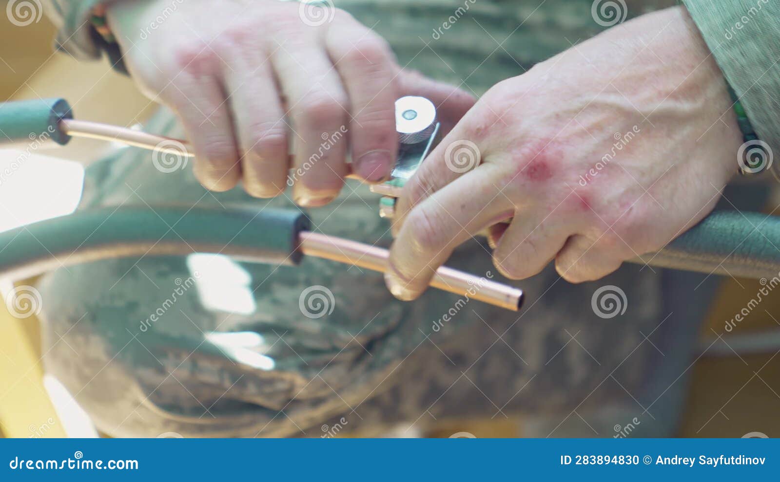 Cutting a Copper Pipe. the Process of Removing the Desired Piece of ...
