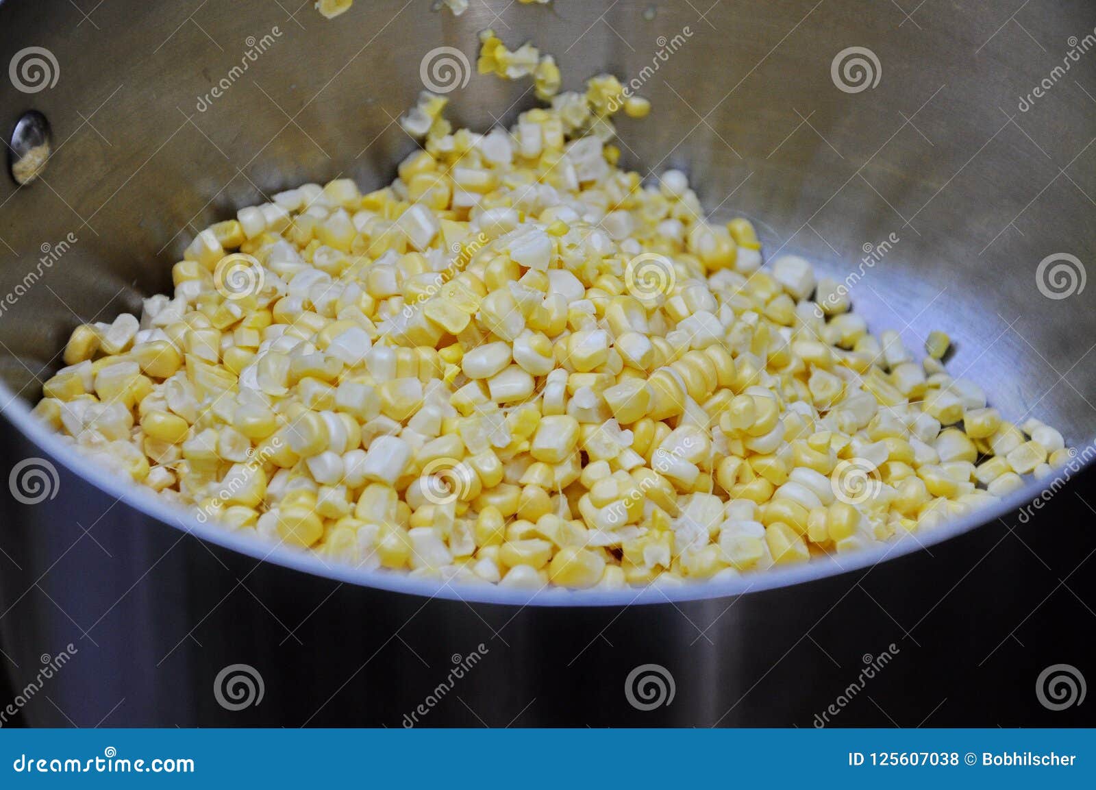 Cutting corn of the cob stock photo. Image of summer - 125607038