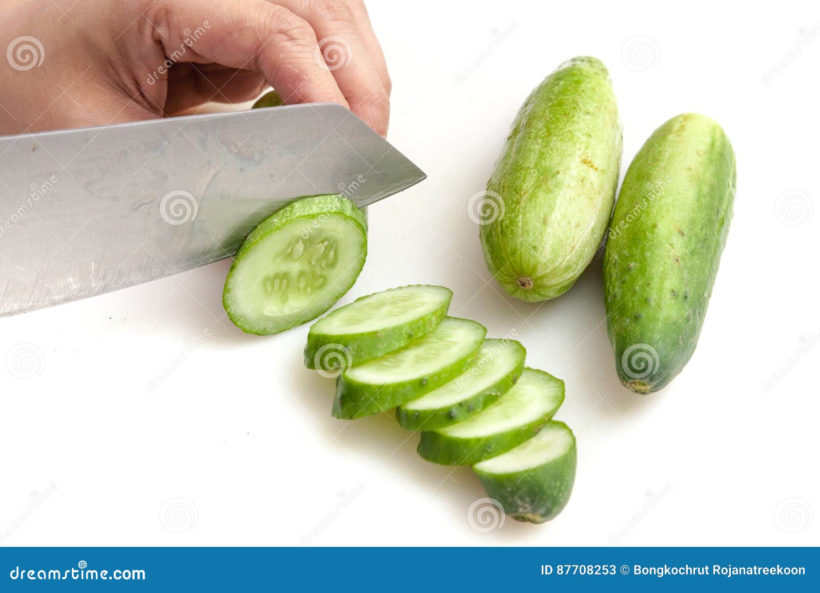 Cutting Cucumbers into Small Slices on White Background Isolated Stock ...