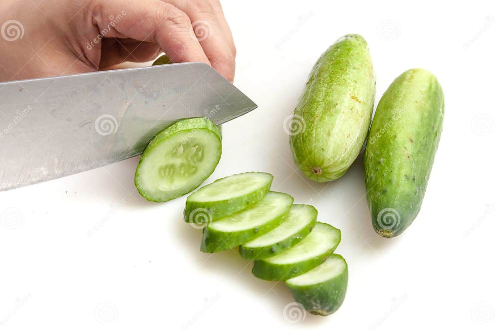 Cutting Cucumbers into Small Slices on White Background Isolated Stock ...