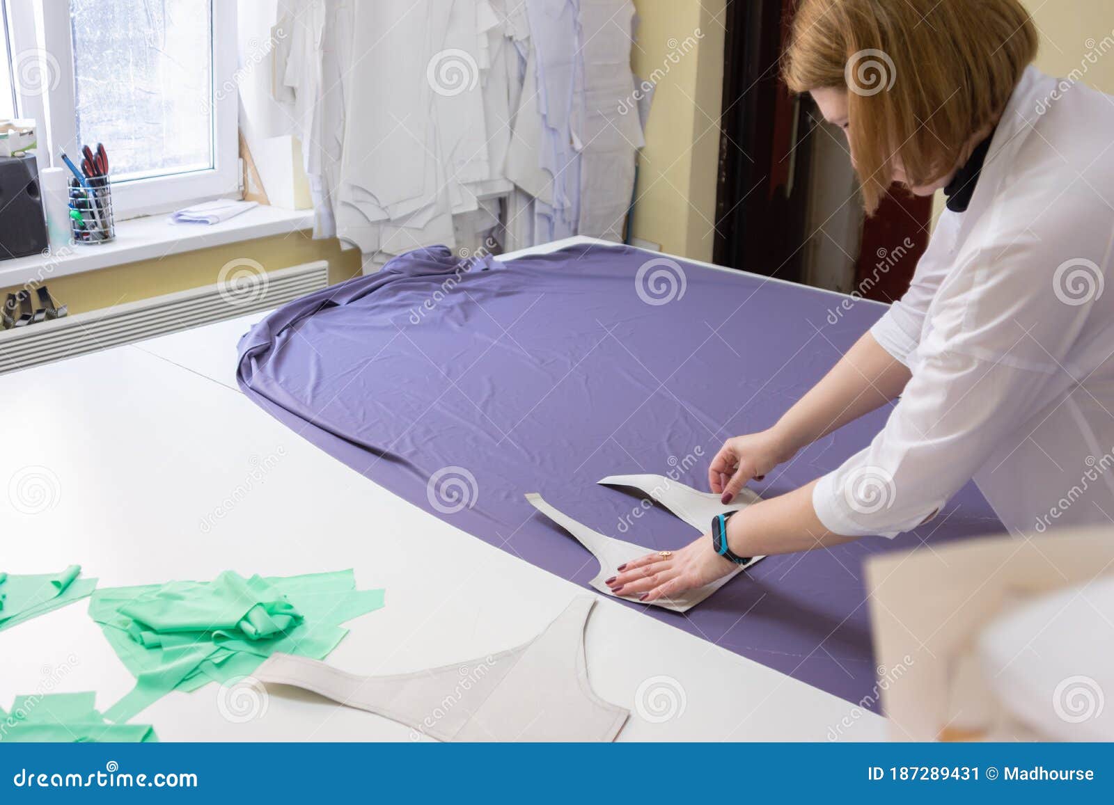 Cutting the Fabric on a Large Table in a Sewing Workshop Stock Image ...