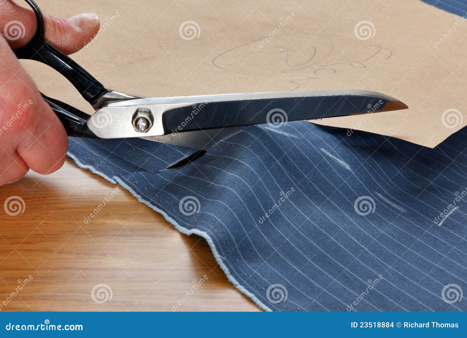 Cutting fabric for a suit stock photo. Image of clothier - 23518884