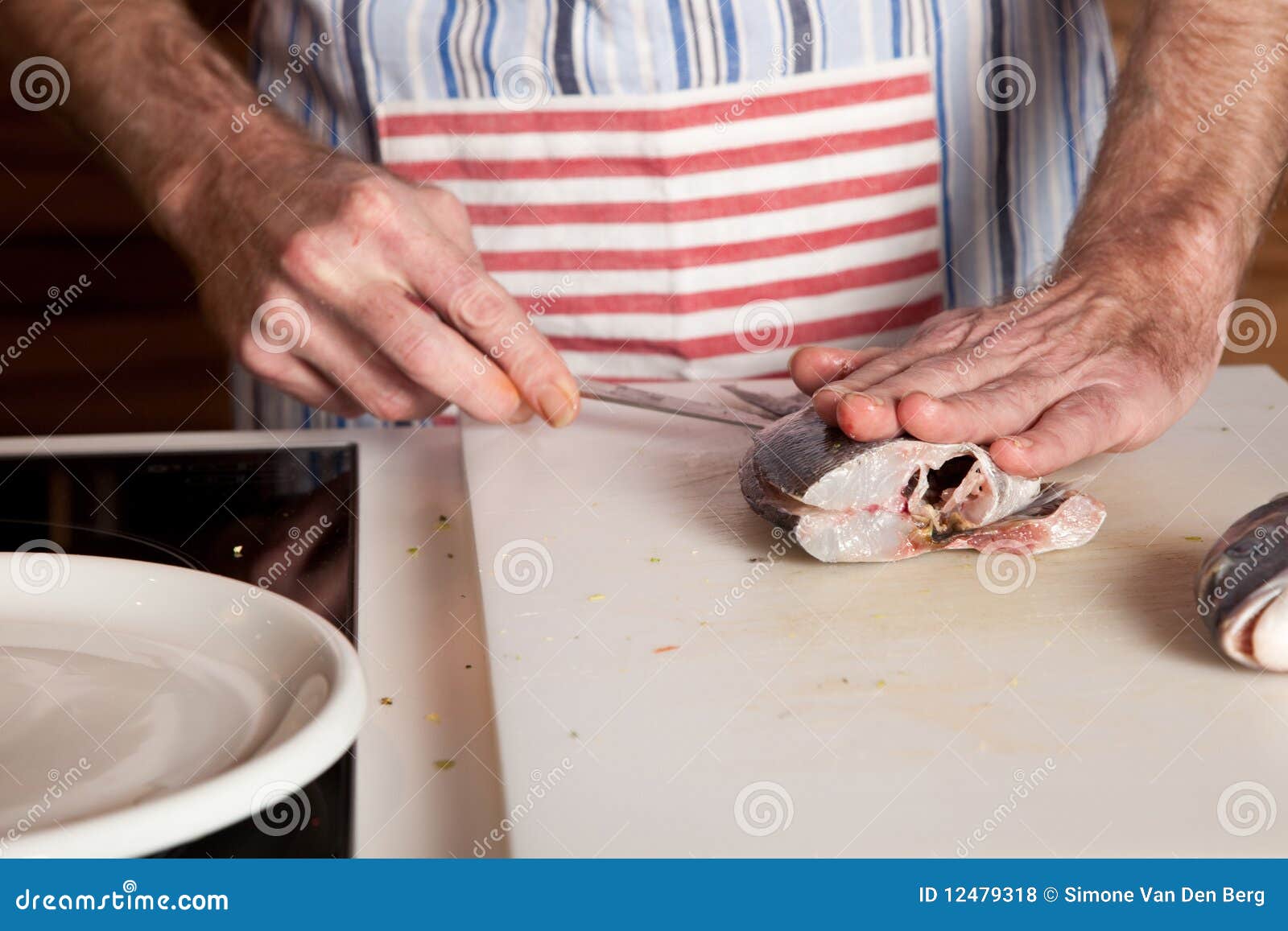 Cutting the fish stock photo. Image of cooking, knife - 12479318