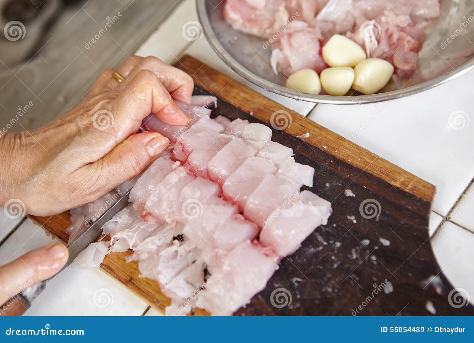 Cutting fish stock image. Image of finger, kitchen, board - 55054489