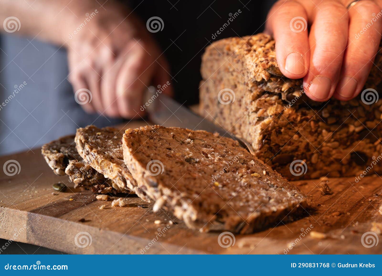 Cutting Fresh Whole Wheat Bread into Slices Stock Photo - Image of ...