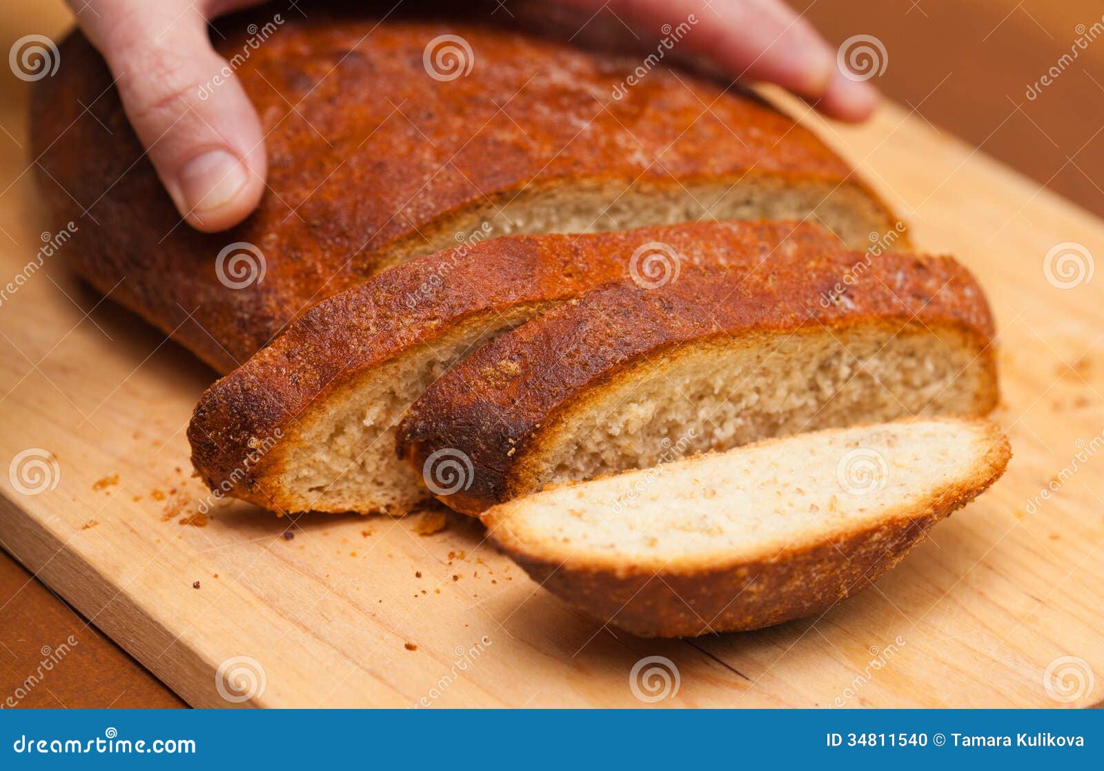 Cutting freshly made bread stock photo. Image of freshly - 34811540