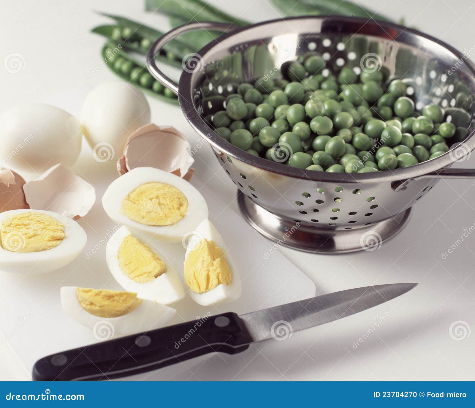 Cutting the Hard-boiled Eggs and Strain the Peas Stock Photo - Image of ...