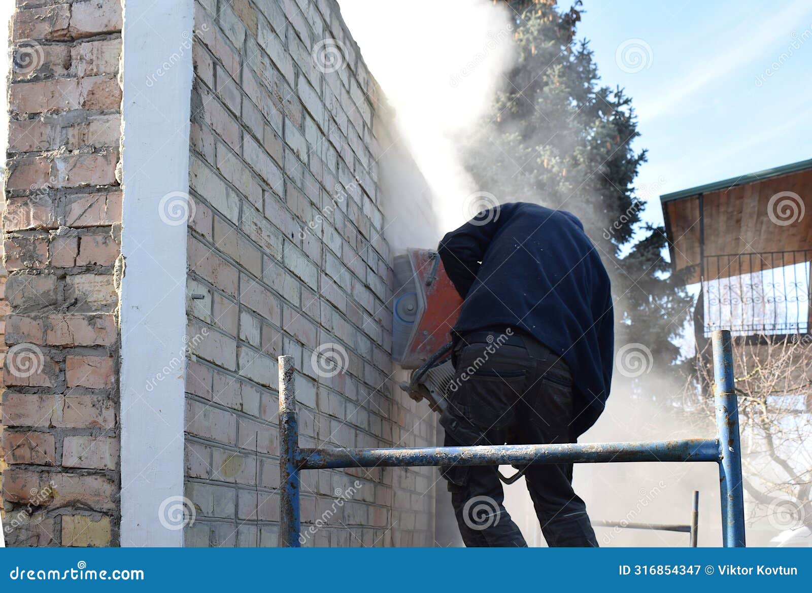 Cutting a Hole in the Wall Using a Cutter Stock Image - Image of ...