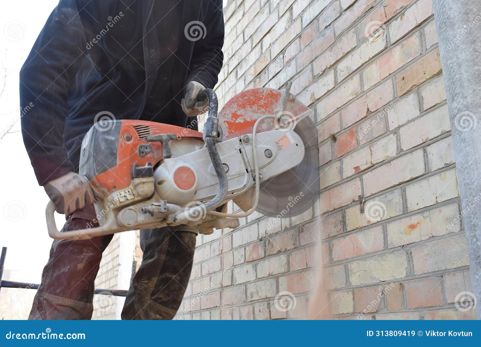 Cutting a Hole in the Wall Using a Cutter Stock Image - Image of cutter ...