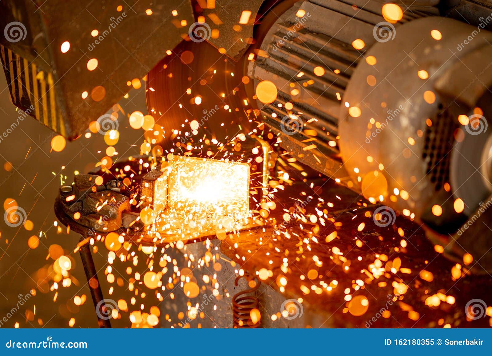 Cutting Industrial Metal with Grinder. Sparks while Grinding Iron Stock ...