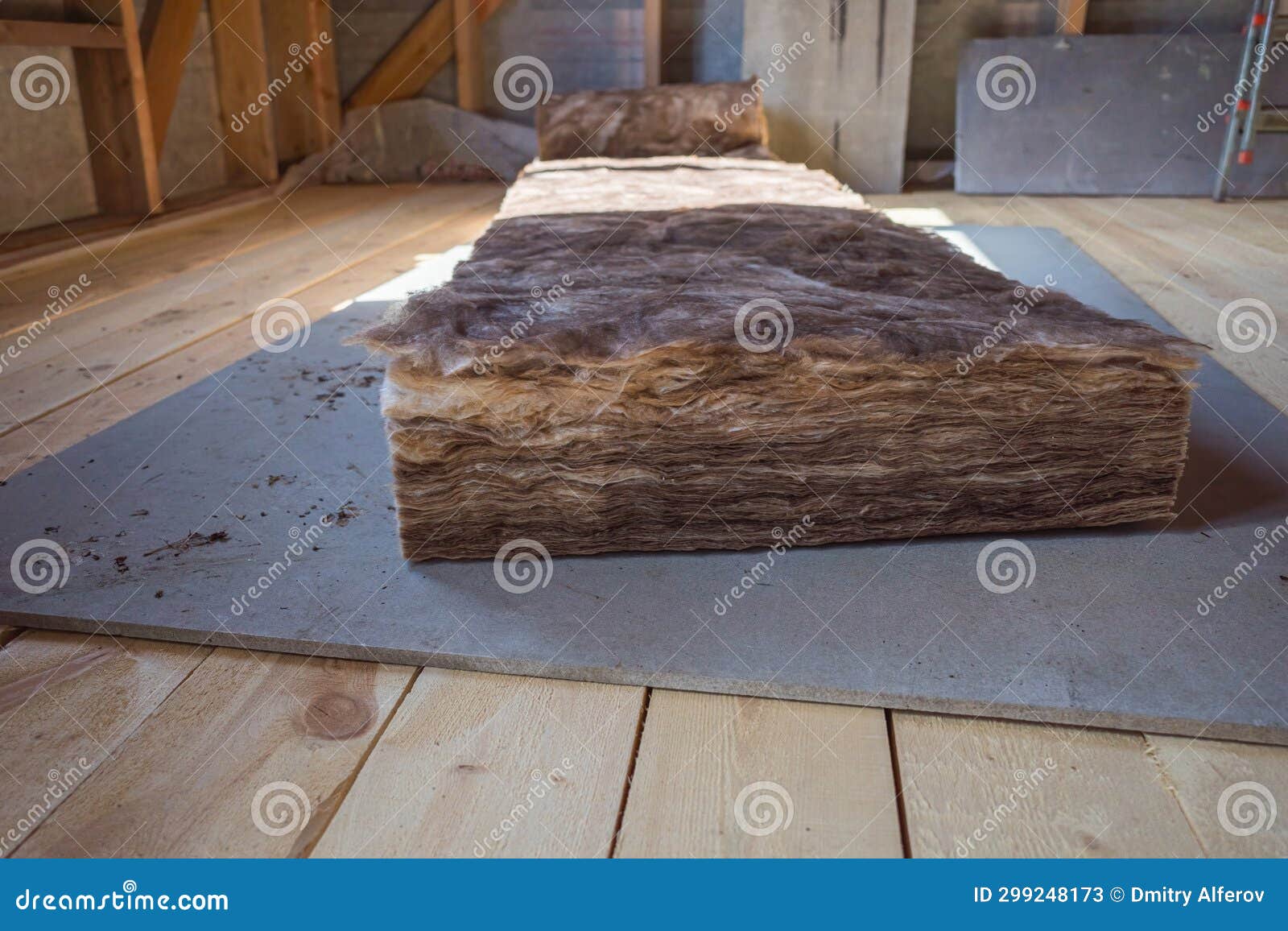 Cutting Insulation for Laying in a Frame House Under Construction ...
