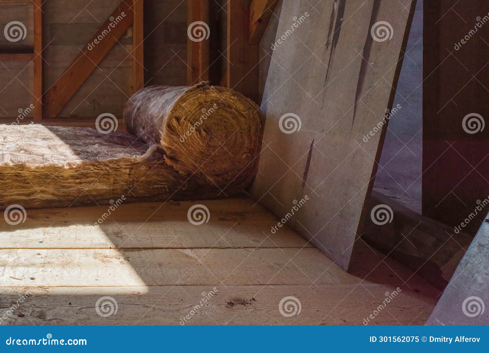 Cutting Insulation for Laying in a Frame House Under Construction ...