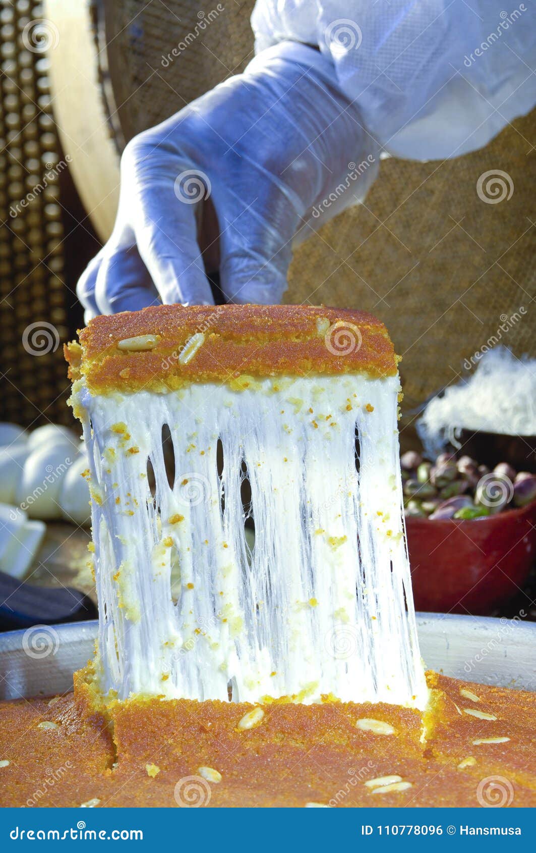 Cutting Kunafa or Kinafa, Arabic Sweets with Cheese for Ramadan a Stock ...