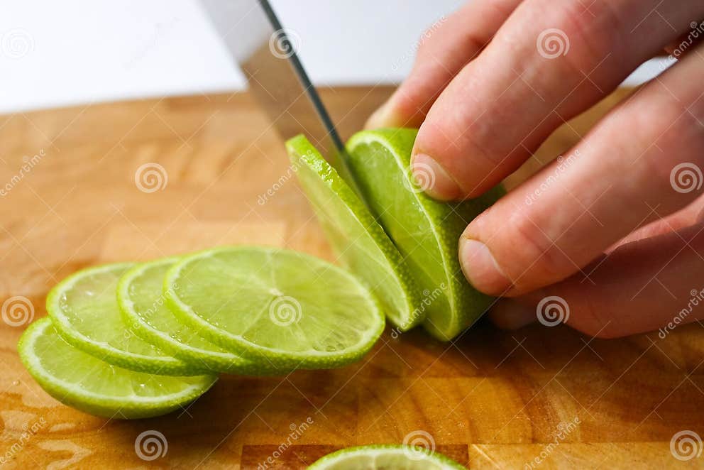 Cutting limes stock image. Image of cutting, kitchen - 25214913