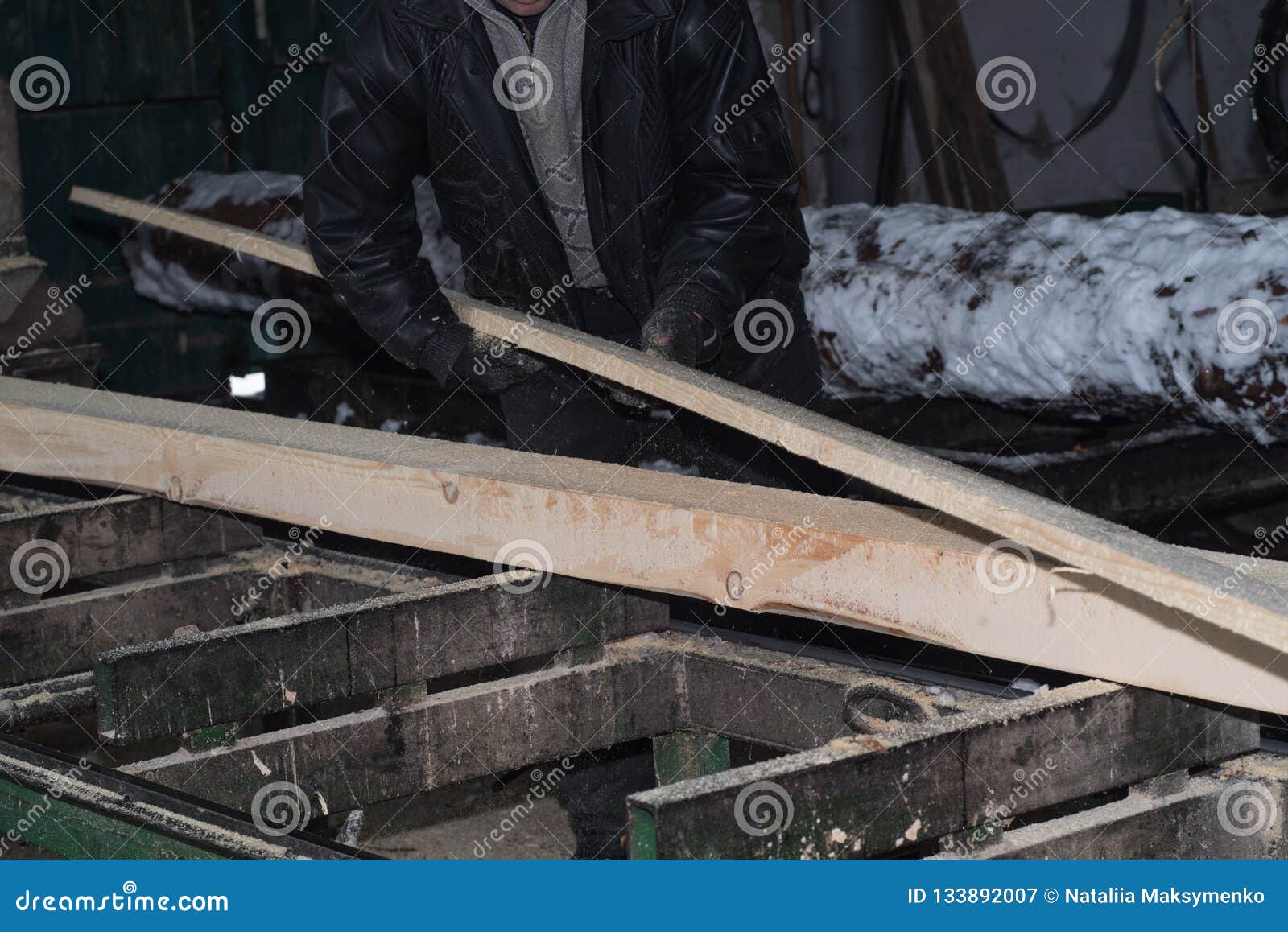 Wood Processing. Cutting Logs on the Boards. in the Winter Process a ...