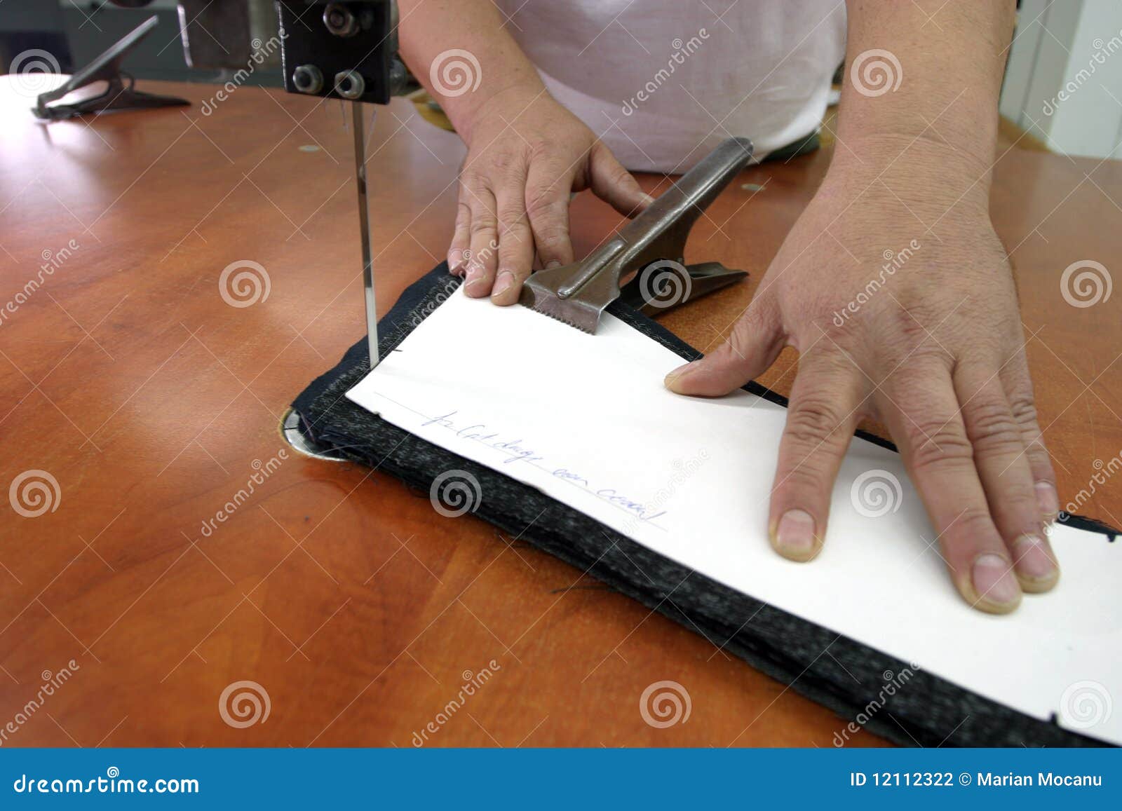 Cutting machine and hands stock photo. Image of seam - 12112322