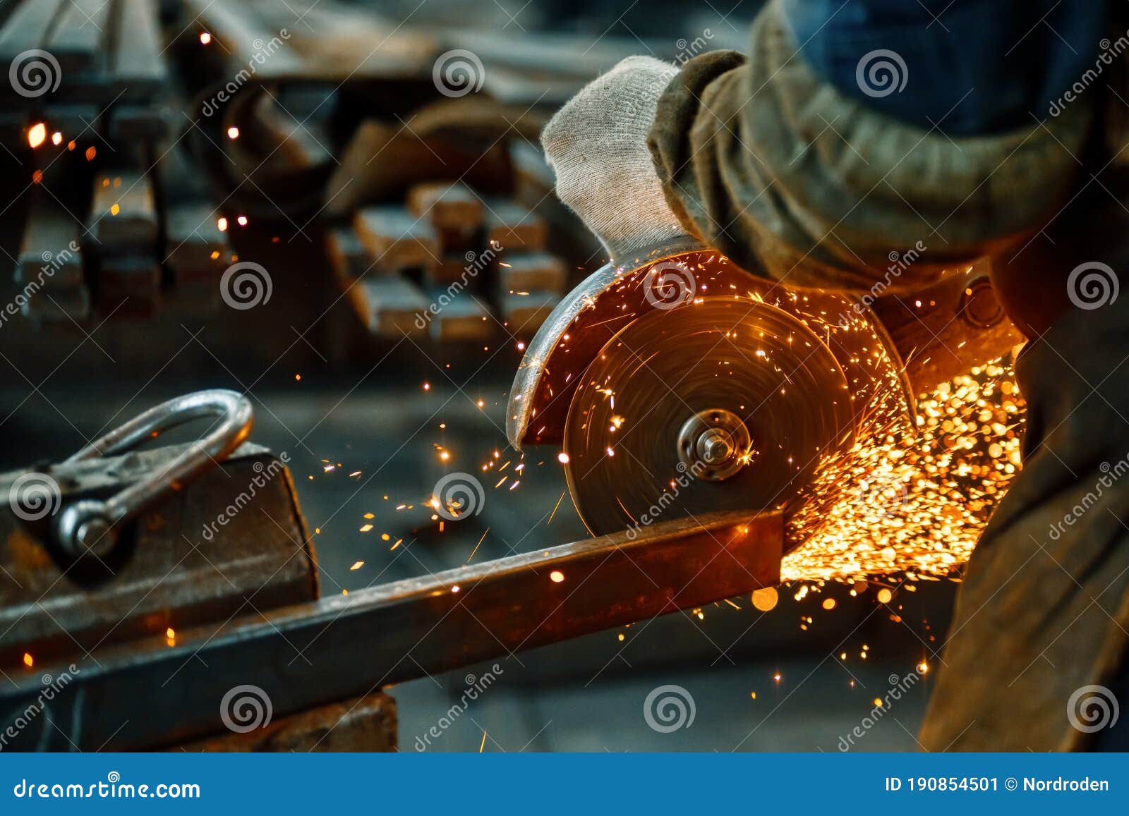 Cutting a Metal Beam Using an Angle Grinder. a Lot of Sparks Fly Out ...