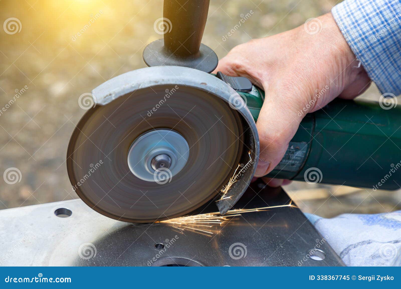 Cutting Metal with a Grinder. Processing and Grinding of Metal with ...