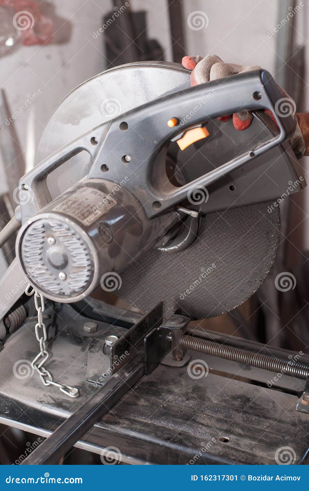 Cutting Metal with Grinder in Workshop. Sparks while Grinding Iron ...