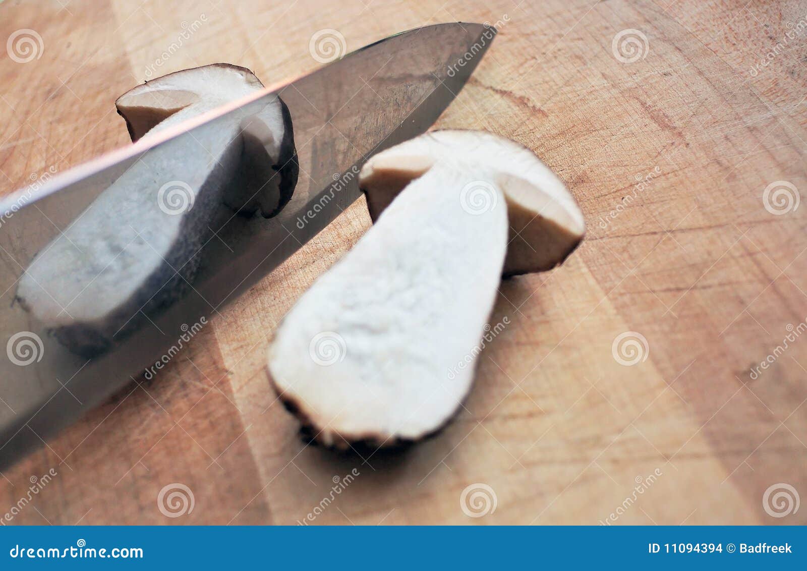 Cutting mushroom in half stock photo. Image of meal, eating - 11094394
