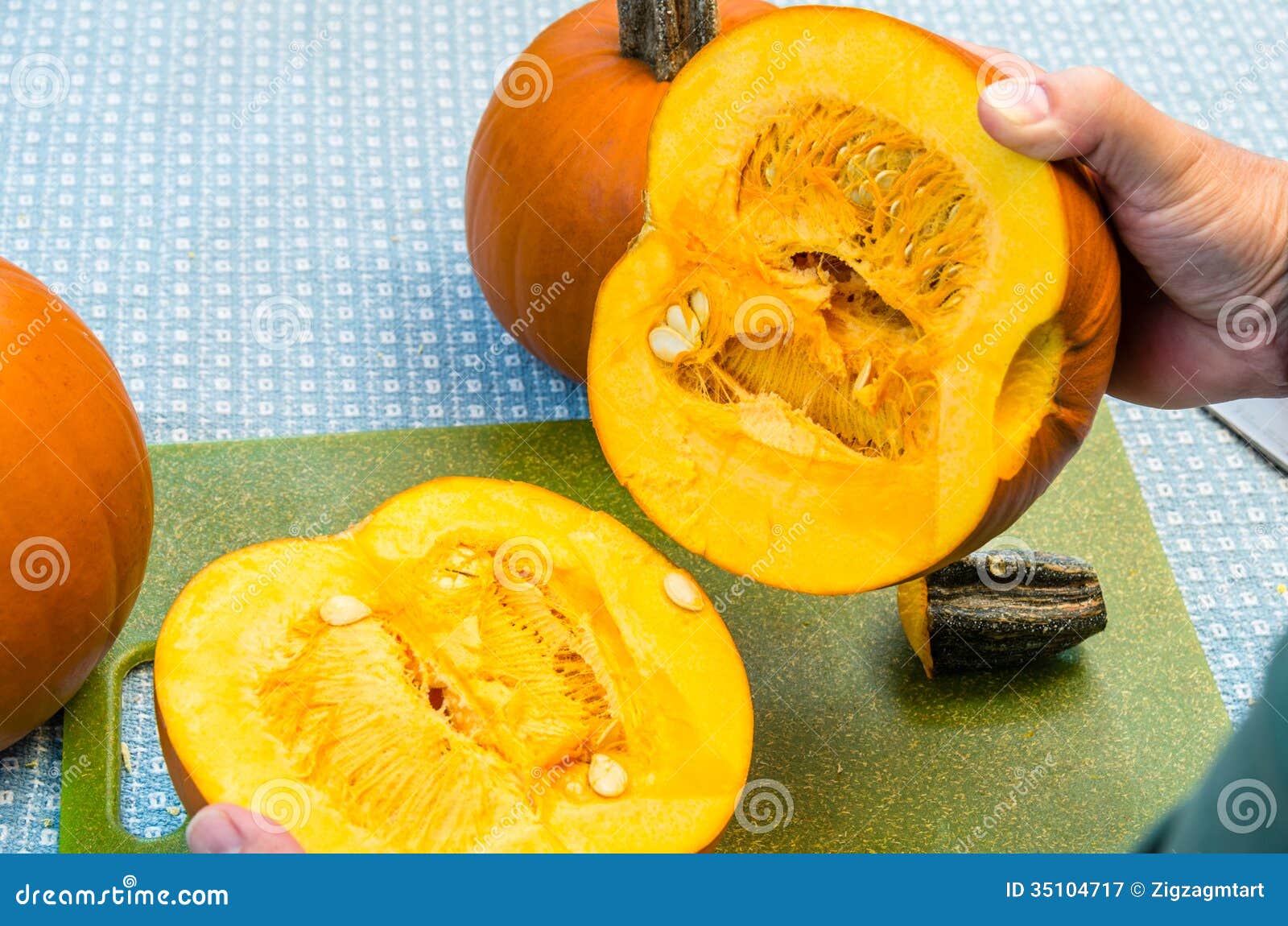 Cutting Open a Pumpkin in the Kitchen Stock Image - Image of pumpkins ...