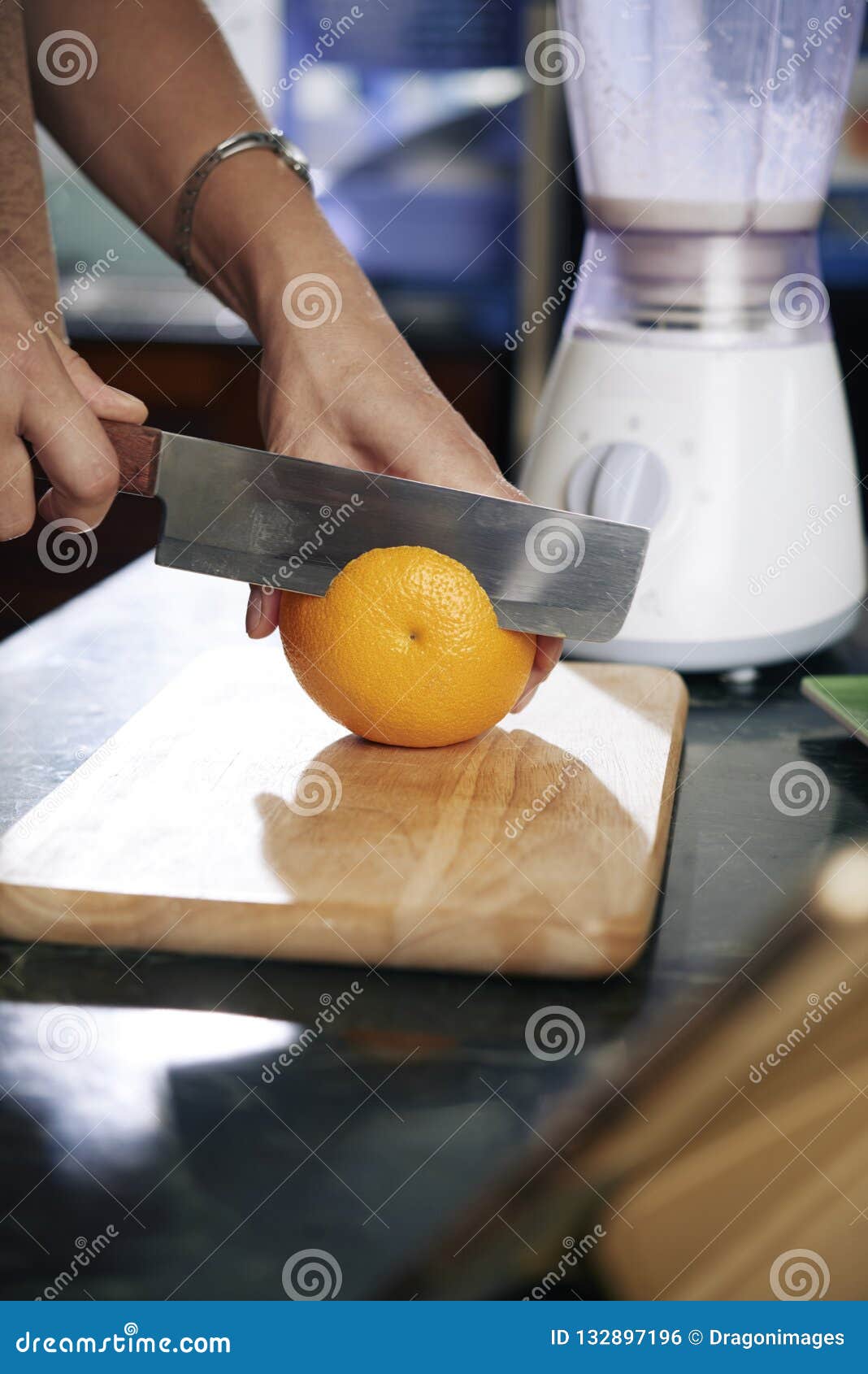 Cutting orange stock photo. Image of healthy, apple - 132897196