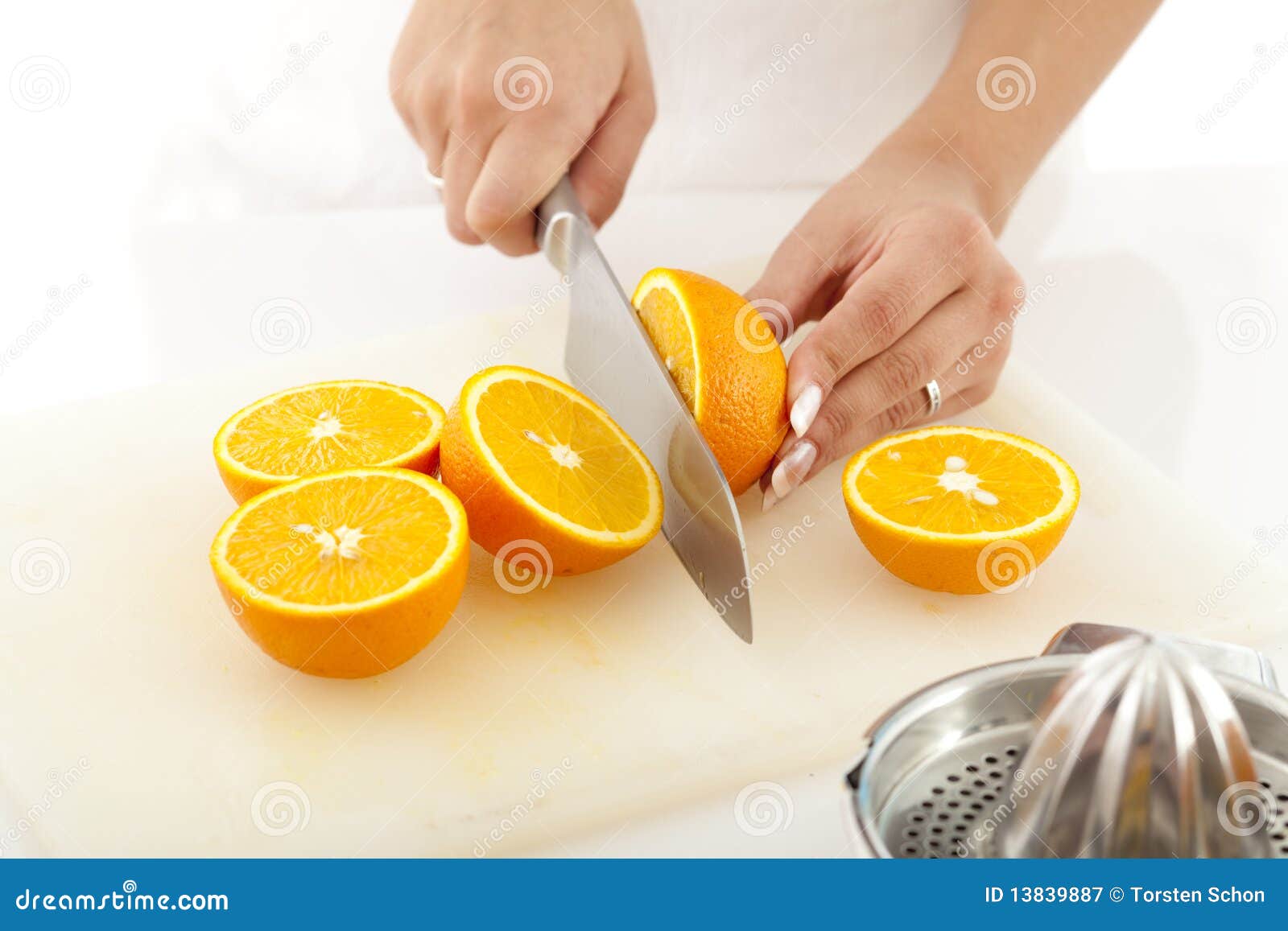 Cutting oranges stock image. Image of fruit, hand, studio - 13839887