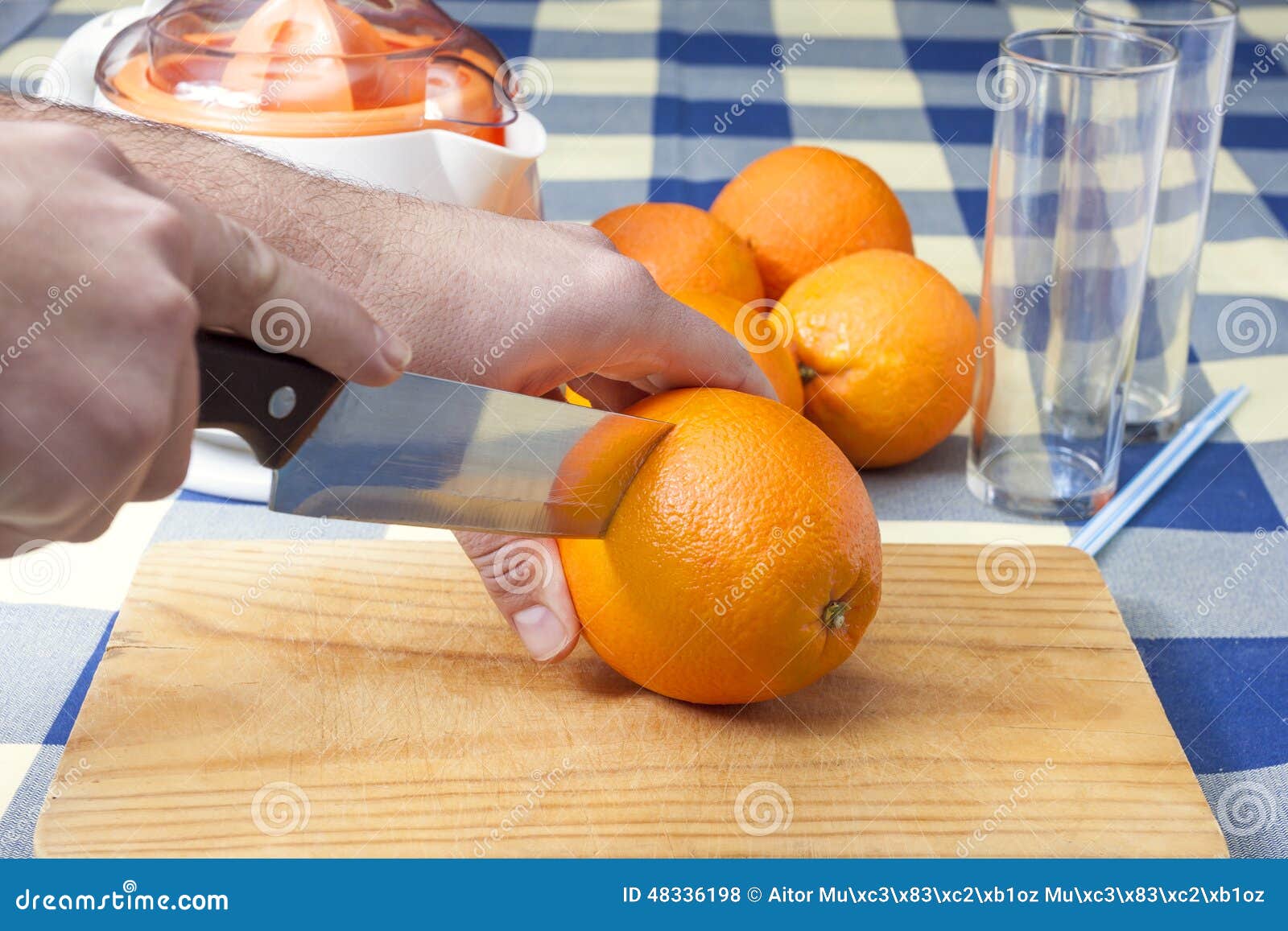Cutting oranges stock photo. Image of hand, closeup, freshness - 48336198