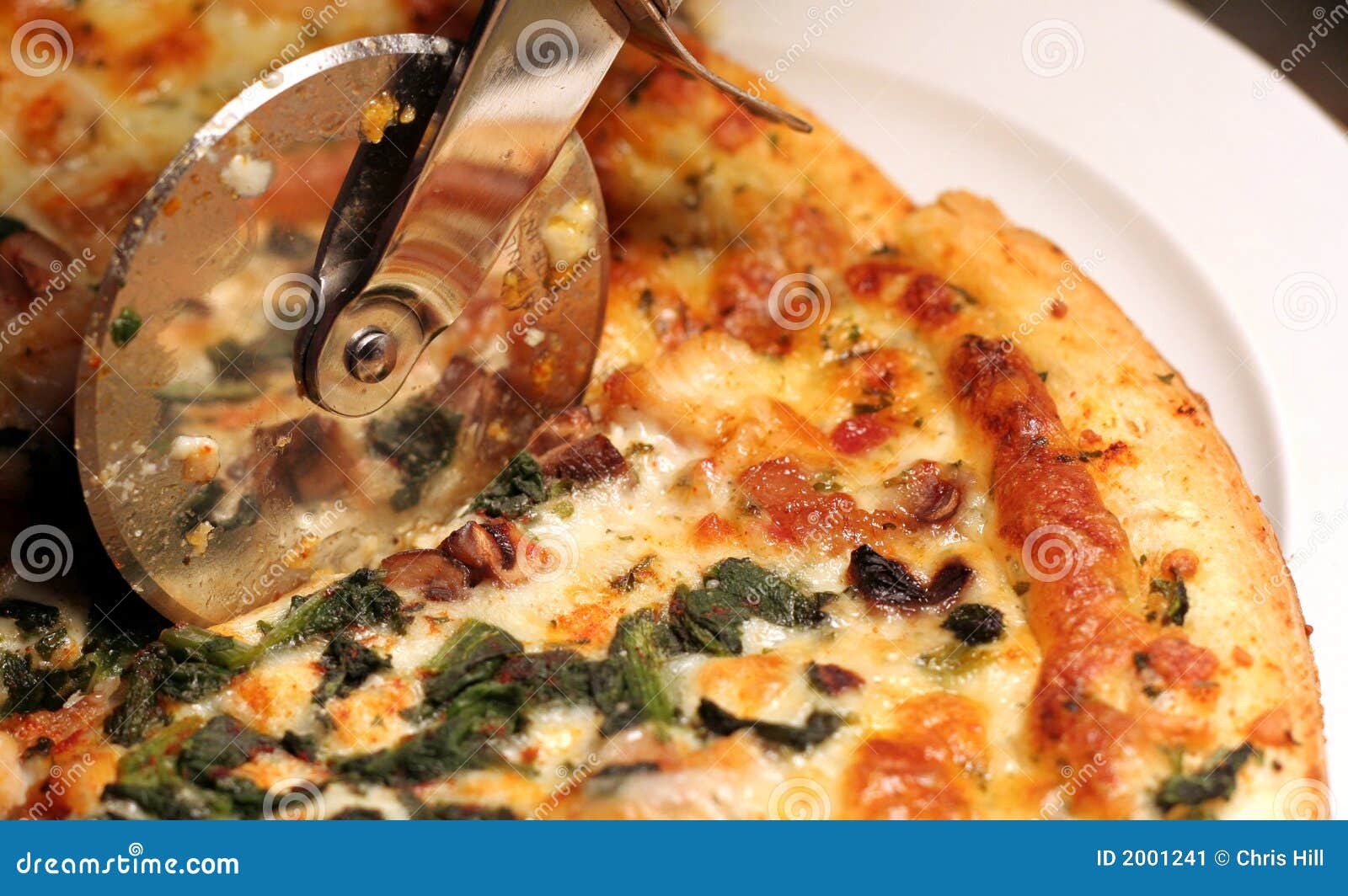 Cutting the Pizza stock image. Image of cheese, hungry - 2001241