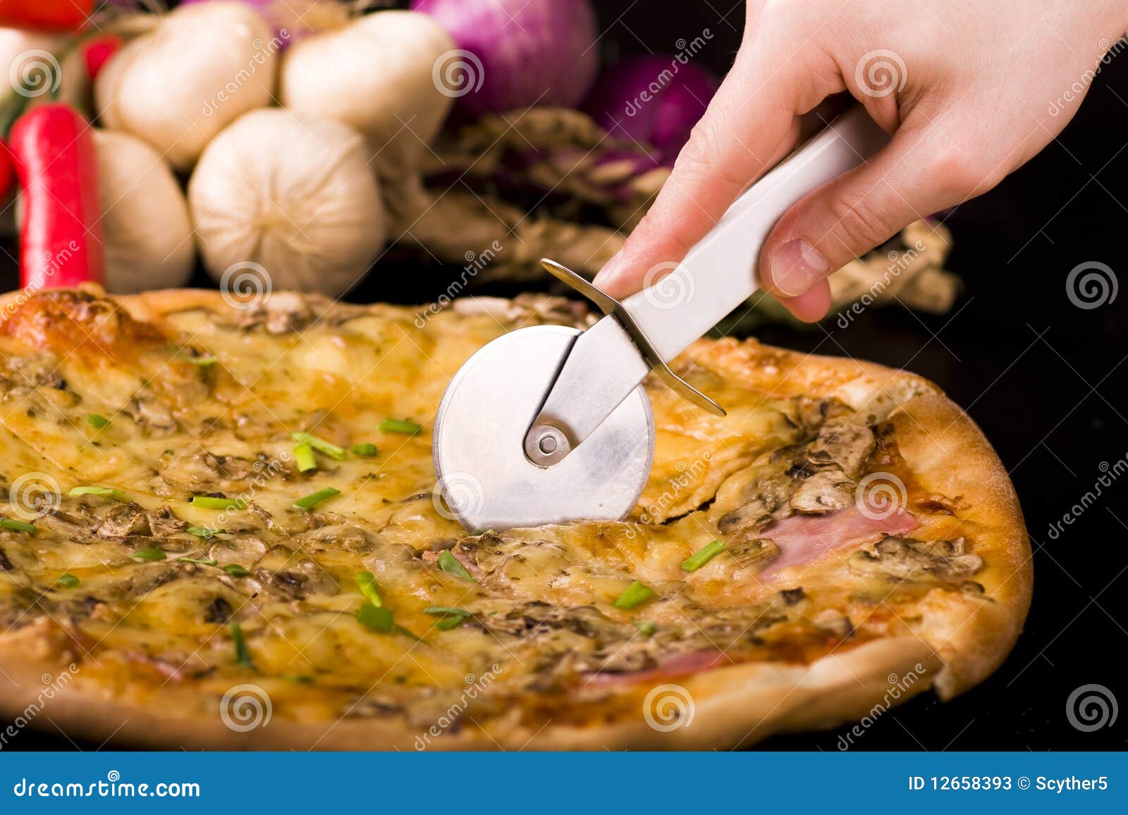 Cutting pizza slices stock image. Image of food, portion - 12658393